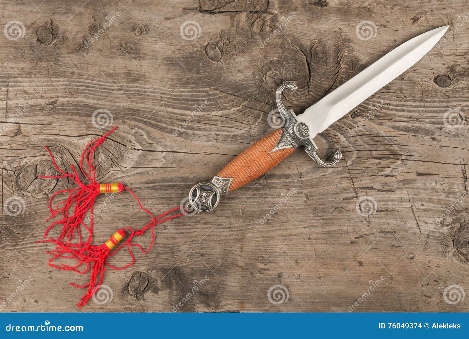 Dagger Lying on a Wooden Surface Stock Photo - Image of nature, hunting ...