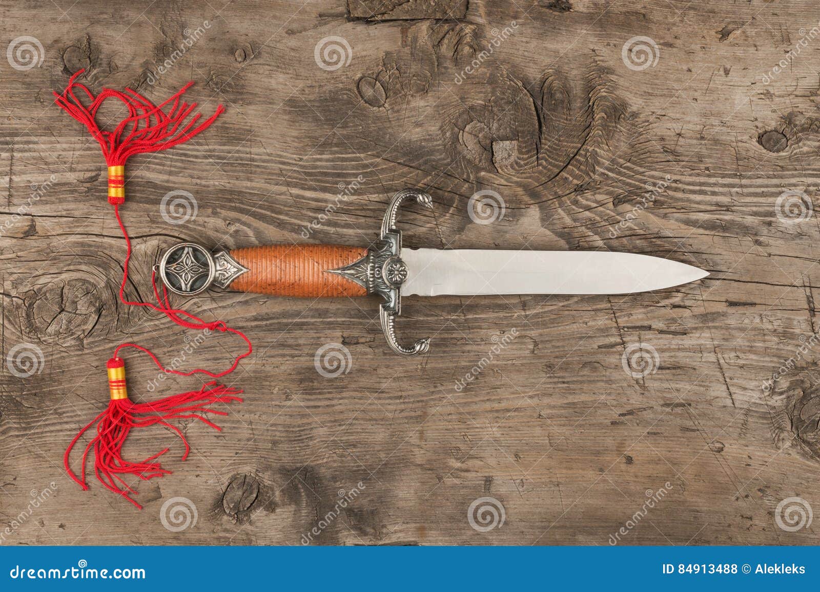 Dagger Lying on a Wooden Surface Stock Photo - Image of handle ...
