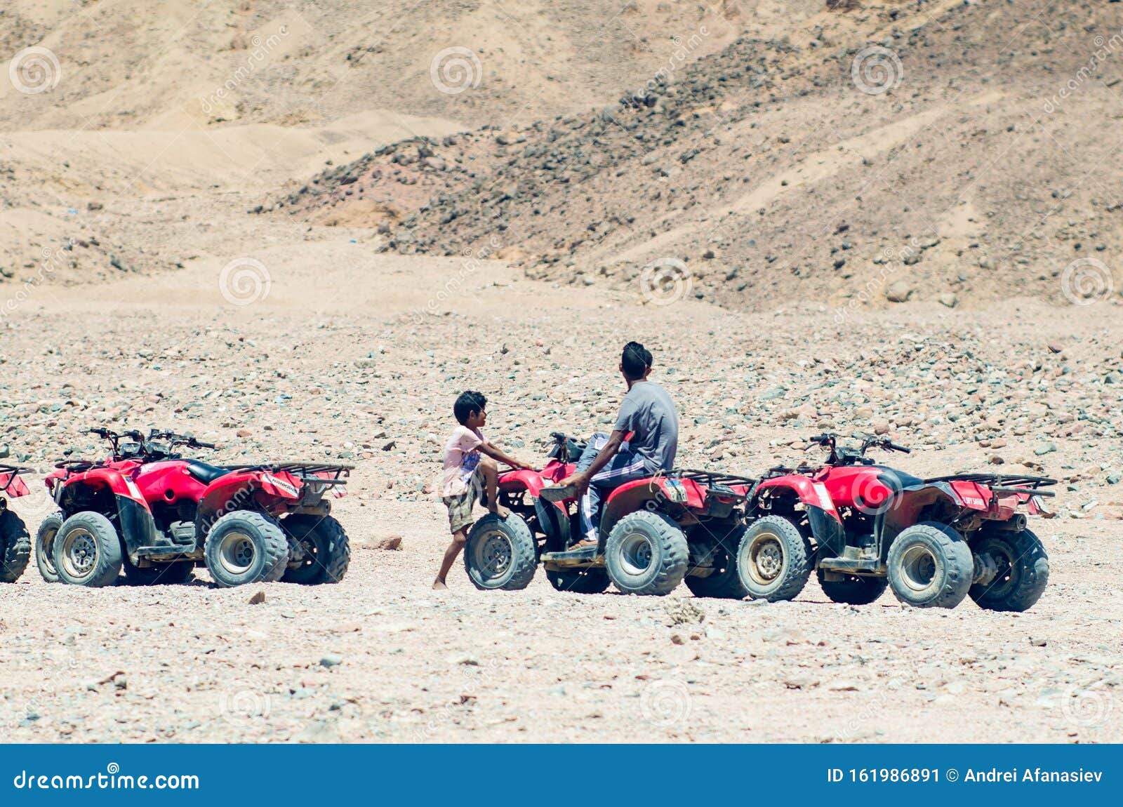 Dahab, Egypt May 11, 2019: Egyptian Boys Sit on ATVs in the Desert ...