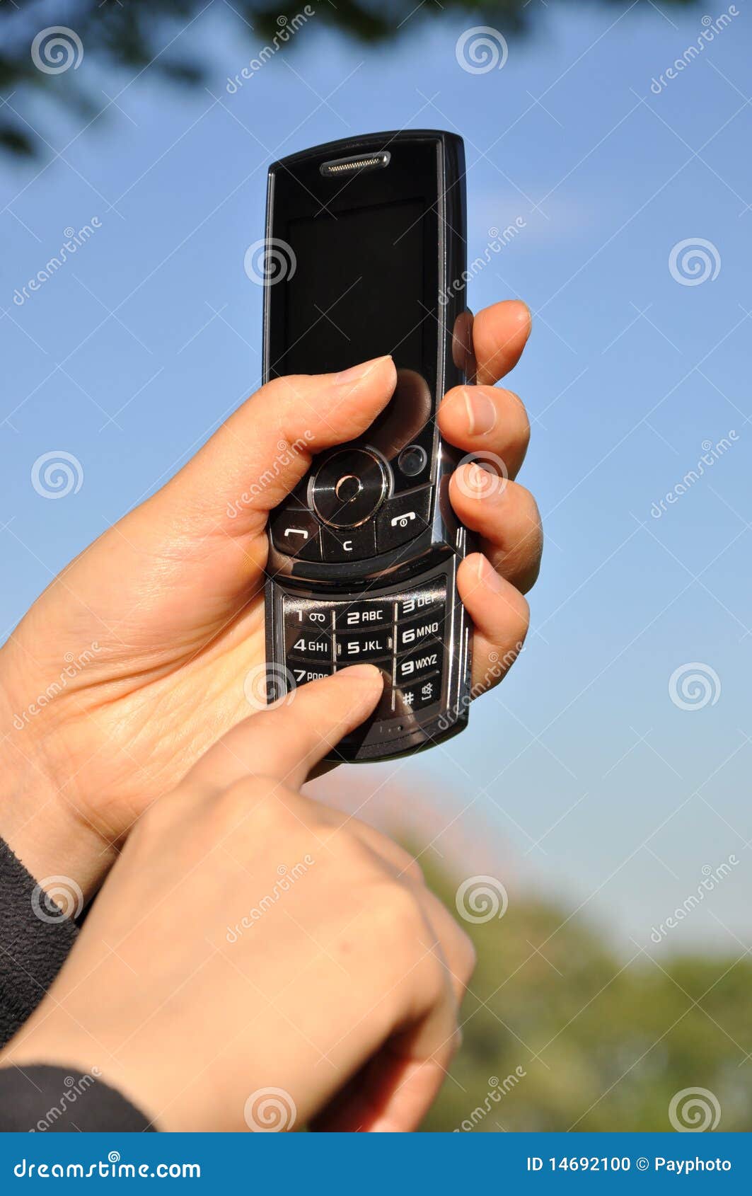 Dailing the cell phone stock photo. Image of blue, nature - 14692100