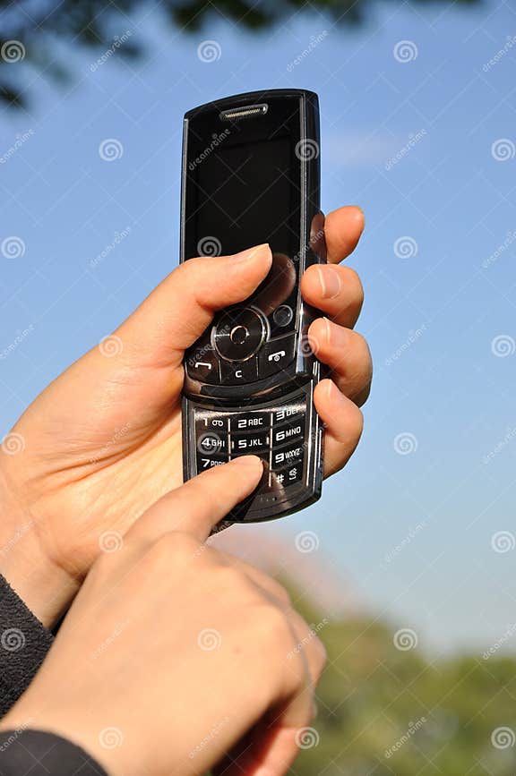 Dailing the cell phone stock photo. Image of blue, nature - 14692100