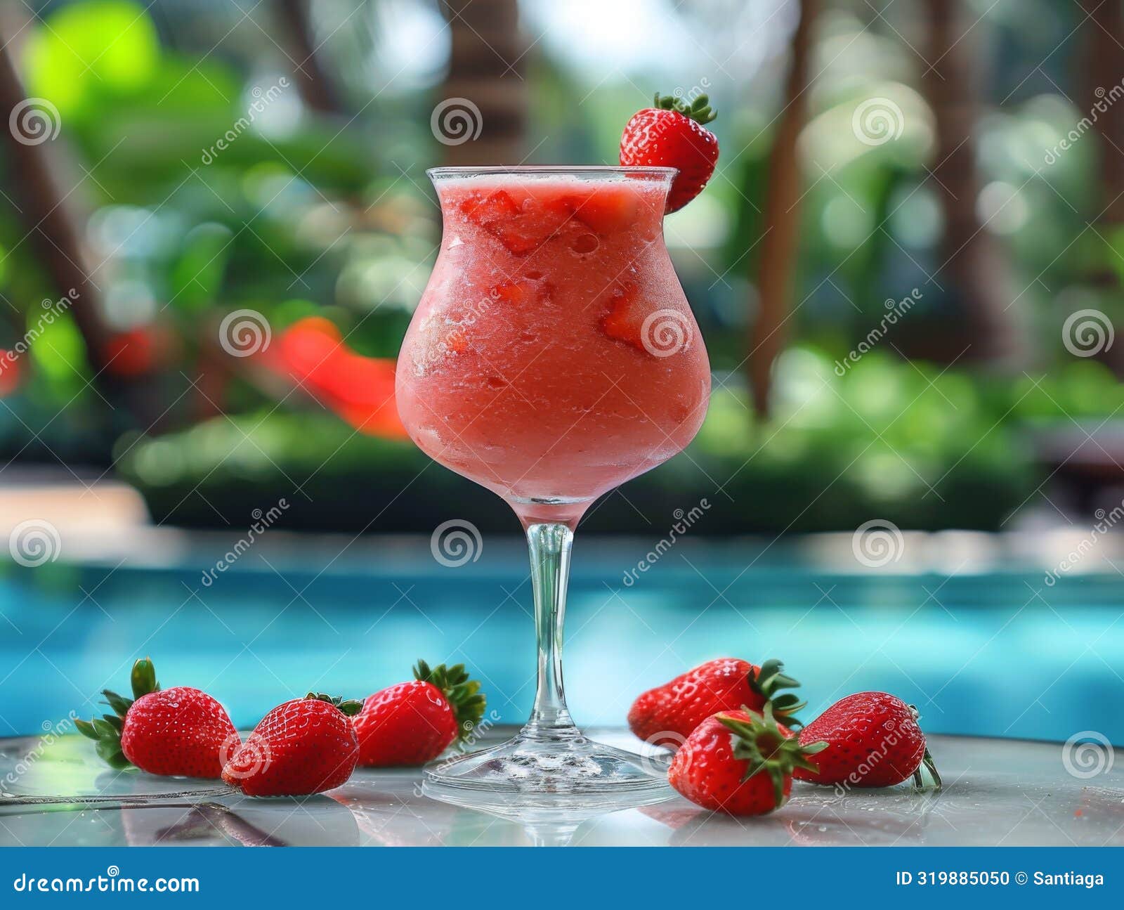 A Daiquiri with Strawberries Standing on a Table by the Pool. Stock ...