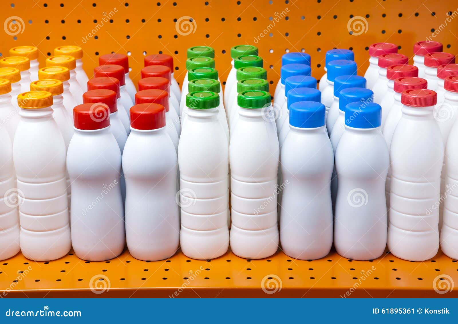 Dairy Products Bottles with Bright Covers on a Shelf in the Shop Stock ...