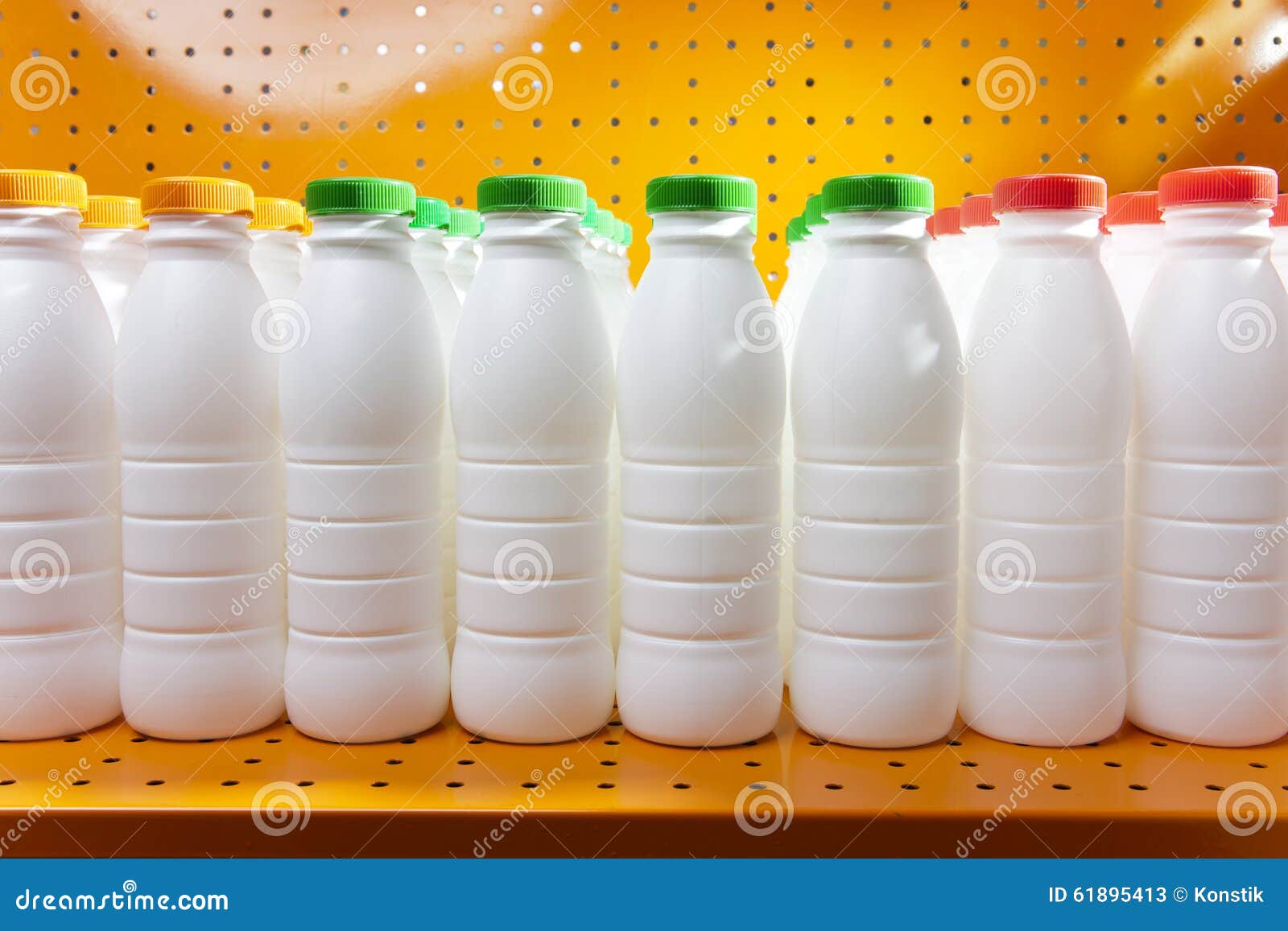 Dairy Products Bottles with Bright Covers on a Shelf in the Shop Stock ...