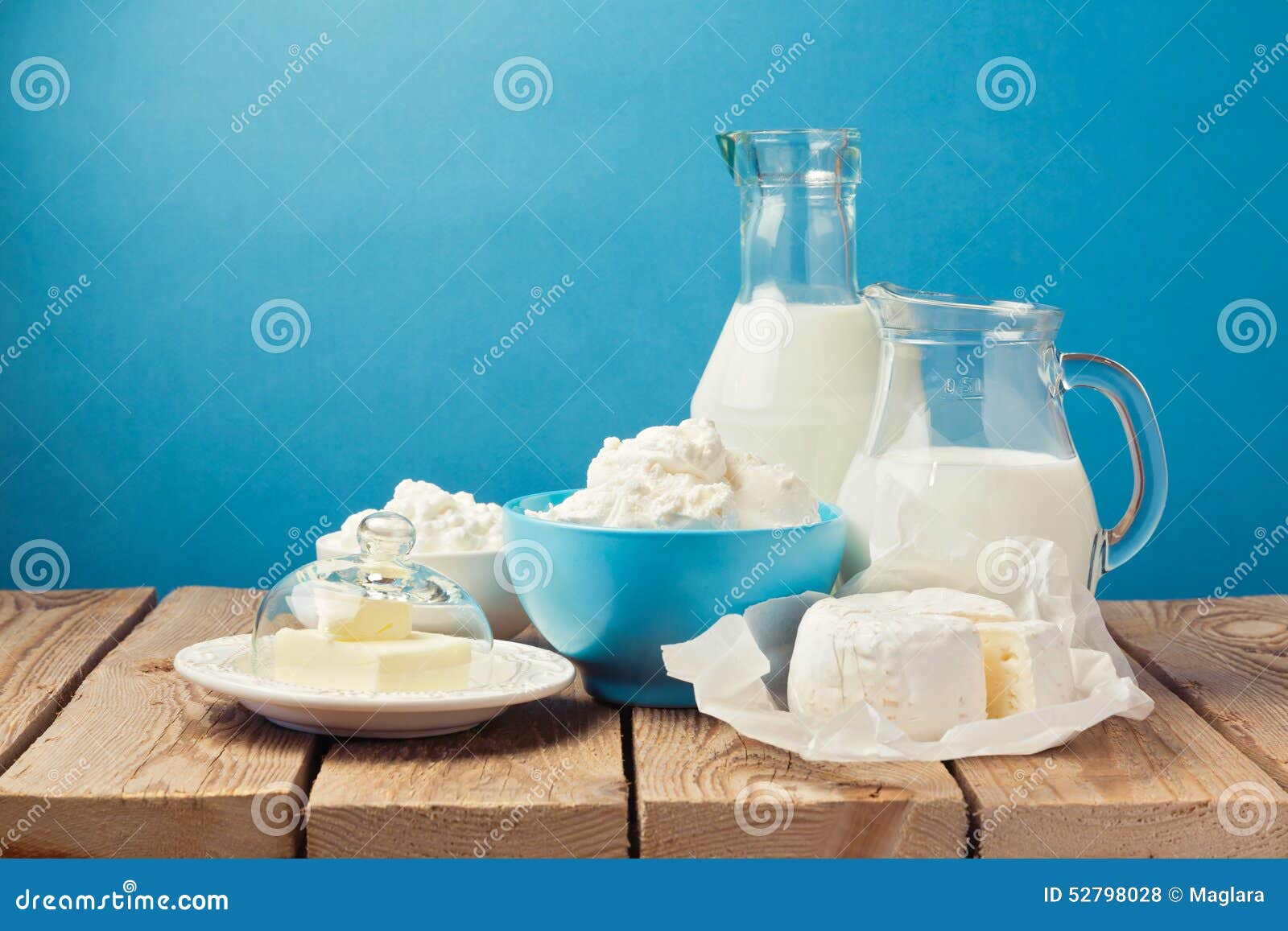 Dairy Products on Wooden Table Over Blue Background Stock Photo - Image ...