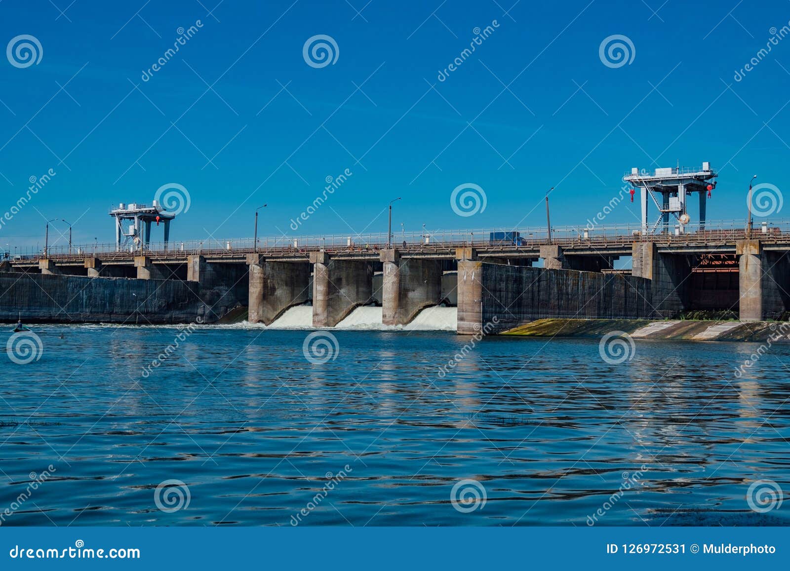 Dam Water Release into River. Water Rushing through Gates Stock Image ...