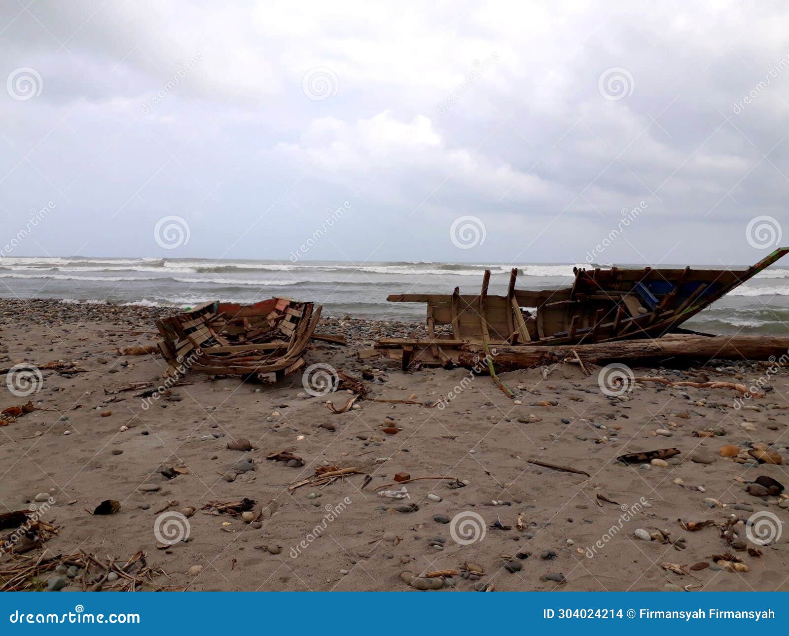 Damaged Boat Hit by Waves Stranded on the Beach Stock Photo - Image of ...