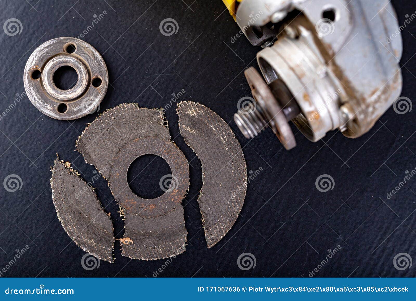 Damaged Cutting Disc for Metal in an Angle Grinder. Power Tools in a ...