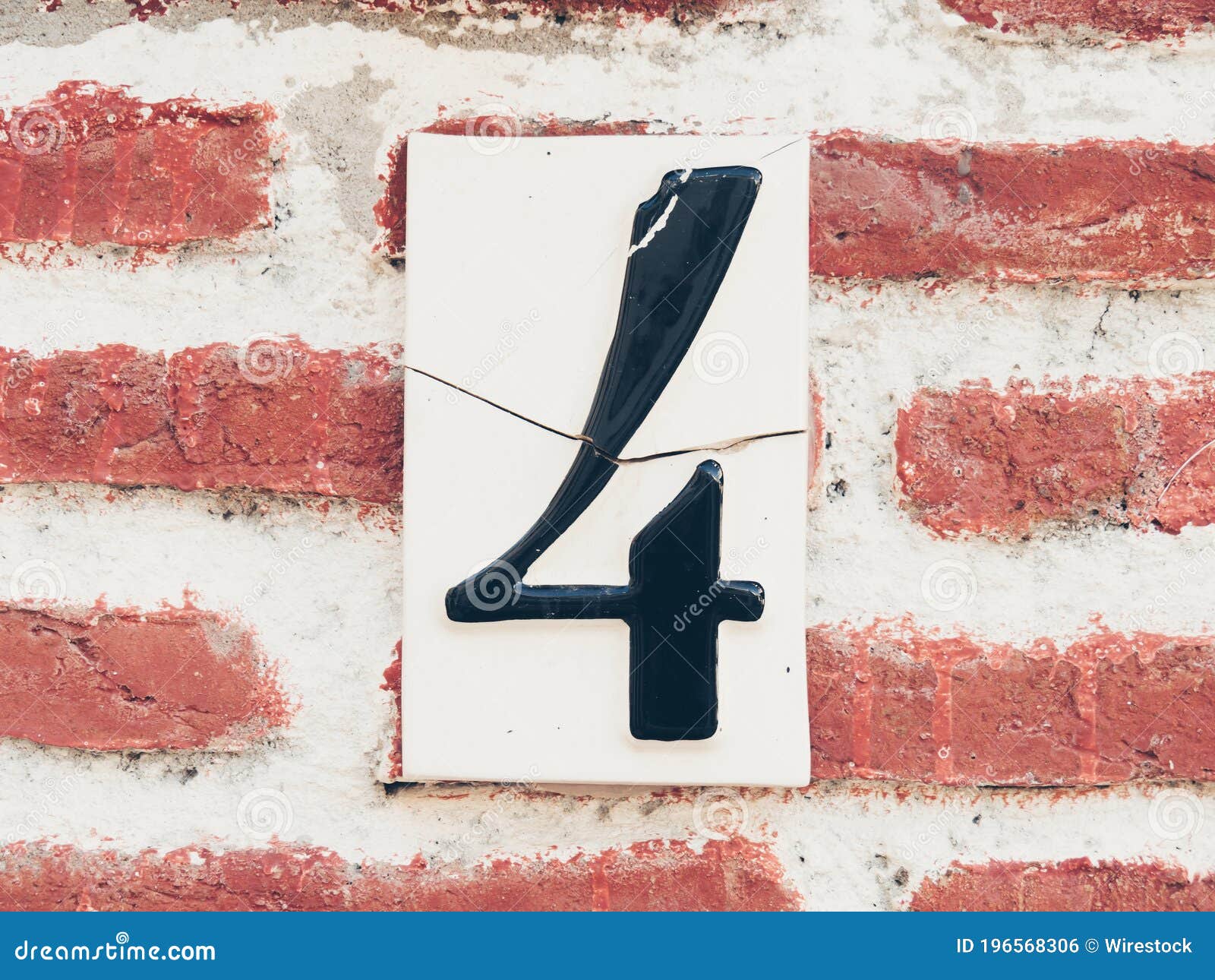 Damaged House Number Tile Placed on the Brick Wall Stock Photo - Image ...