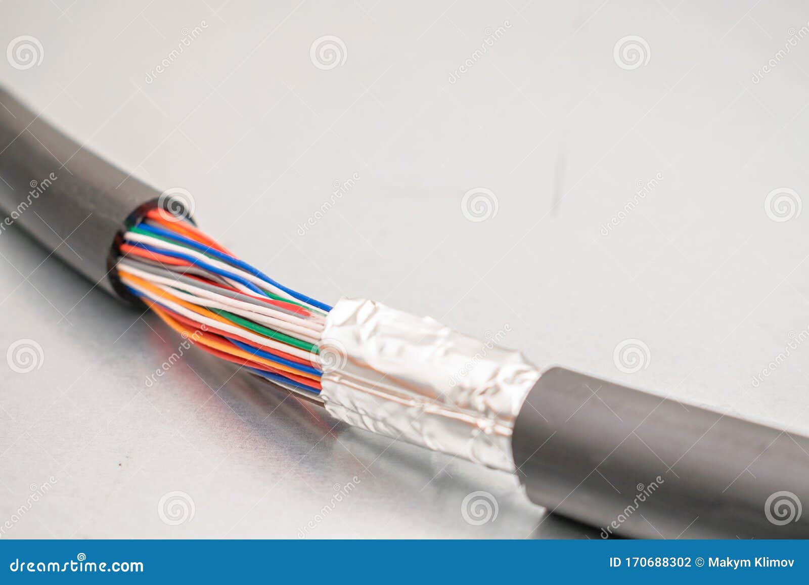 Two Damaged Stranded Wires Are In The Hands Of A Network Engineer.The ...