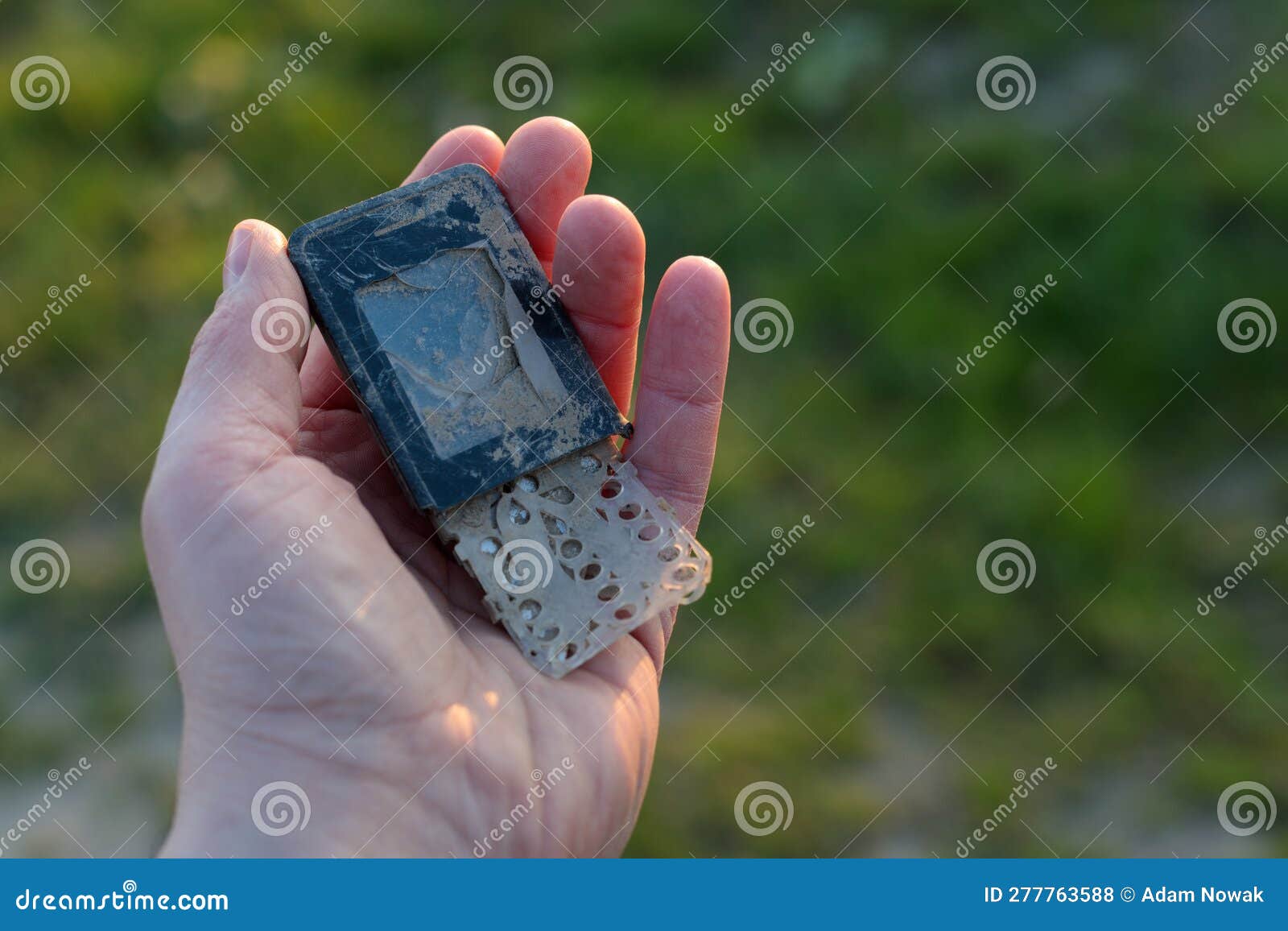 Damaged Old Cell Phone in Hand - E-waste Recycling Issue Stock Photo ...