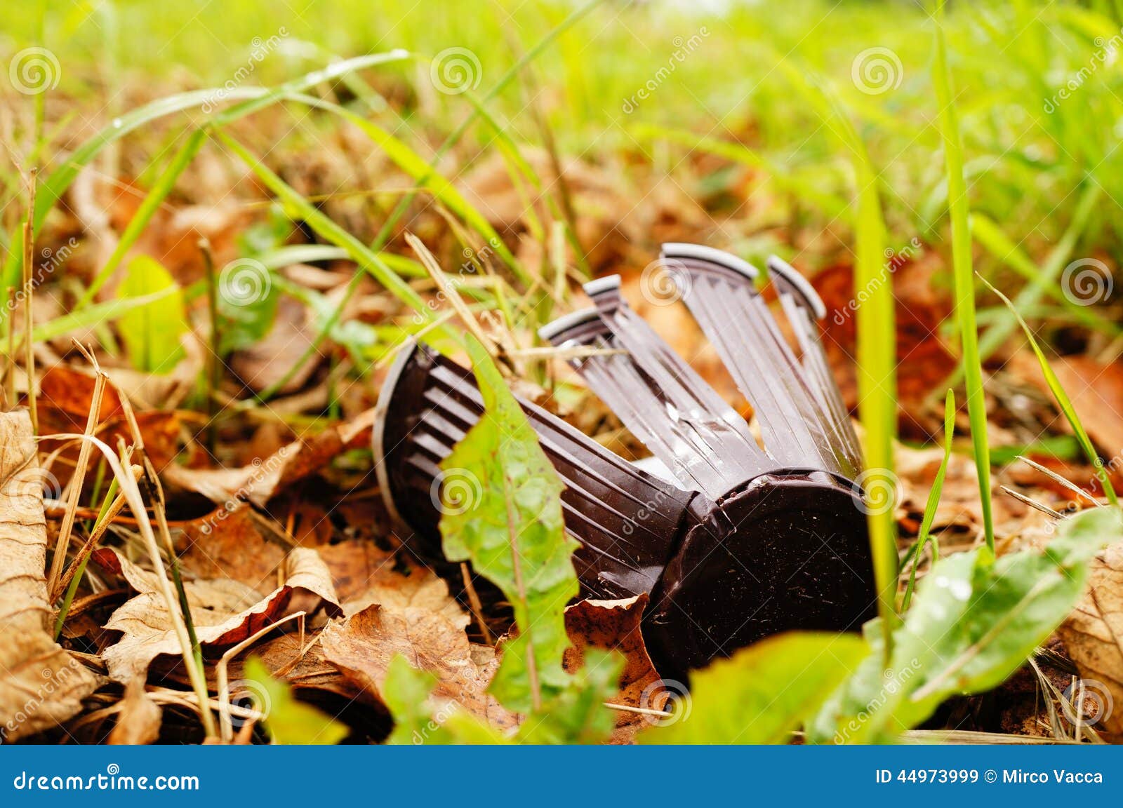 Damaged plastic cup stock image. Image of ground, grass - 44973999