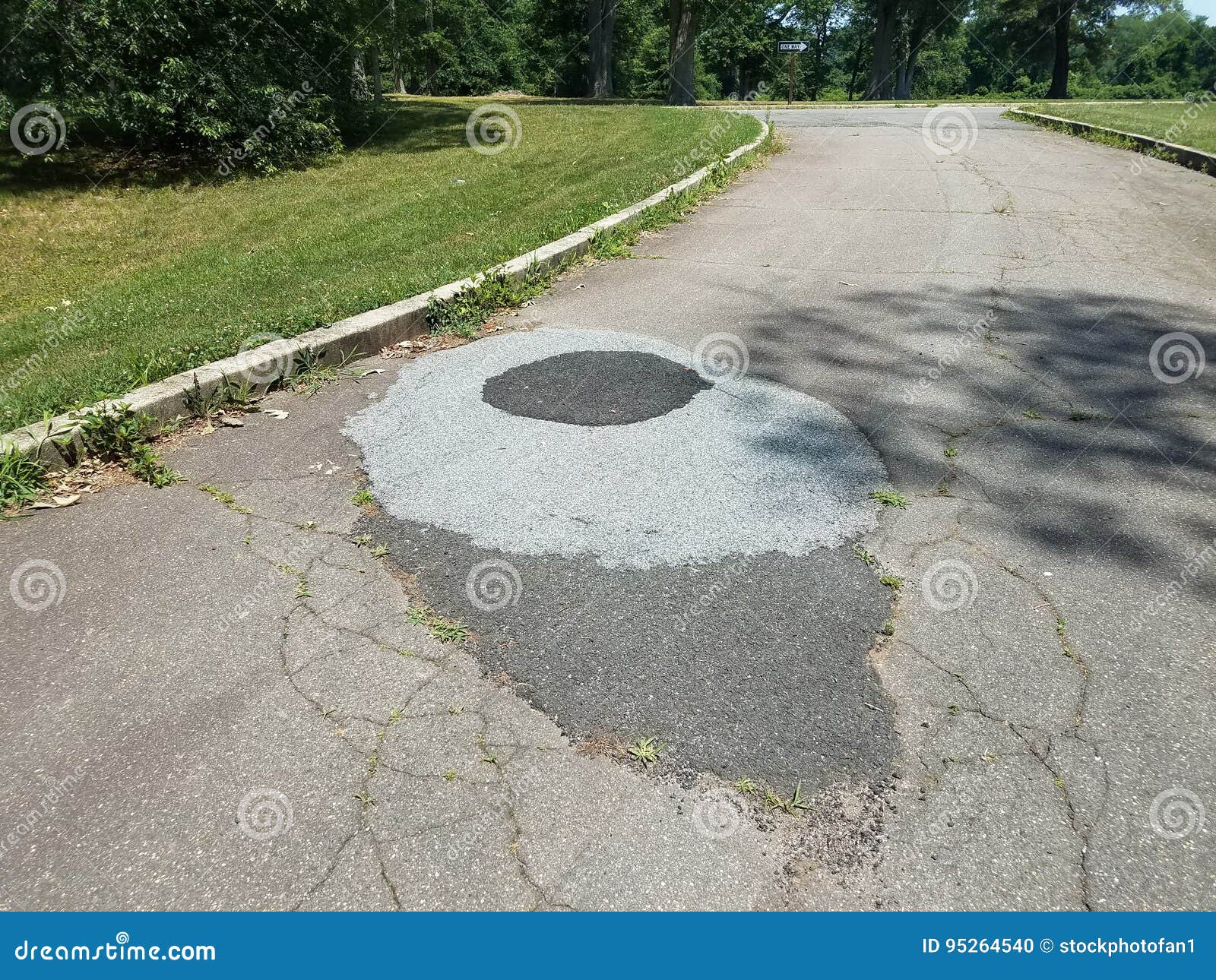 Damaged and Repaired Asphalt Street Stock Photo - Image of path ...