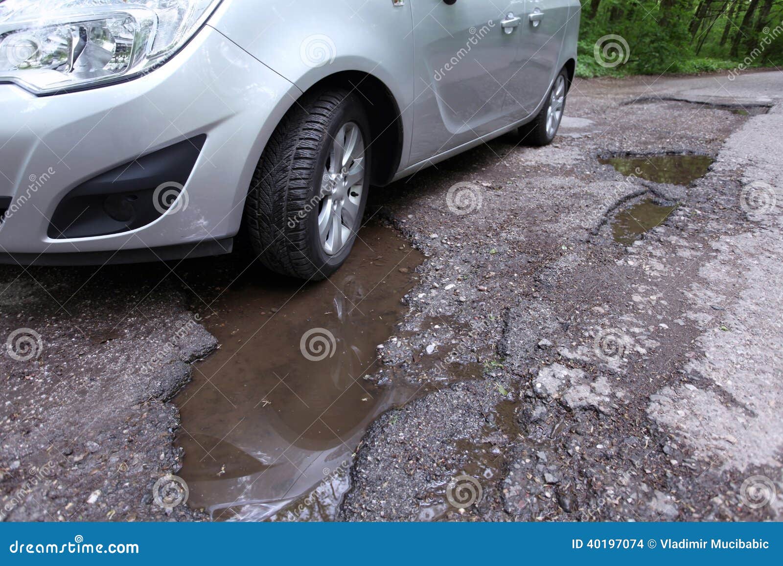 Damaged Road, Cracked Asphalt Sword With Potholes And Spots. Very Bad ...