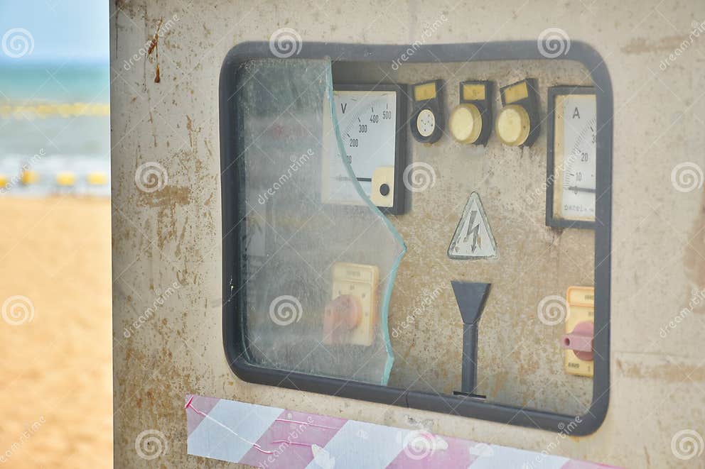 A Damaged and Rusted Electrical Control Panel Has Broken Glass Shards ...