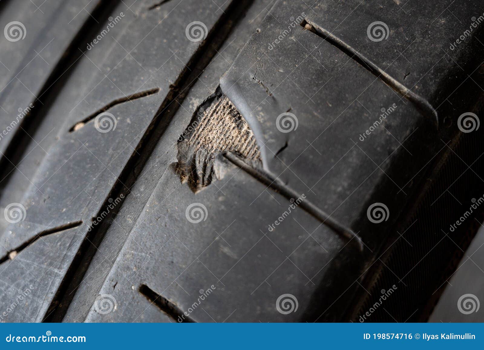 Damaged Car Tyre Stock Photo | CartoonDealer.com #141152418