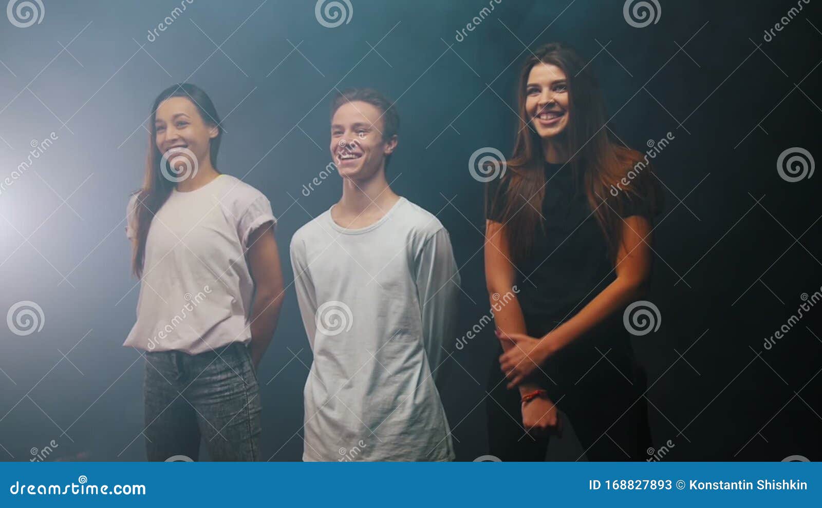 Dance Group of Three Smiling People Standing in the Studio Stock Video ...