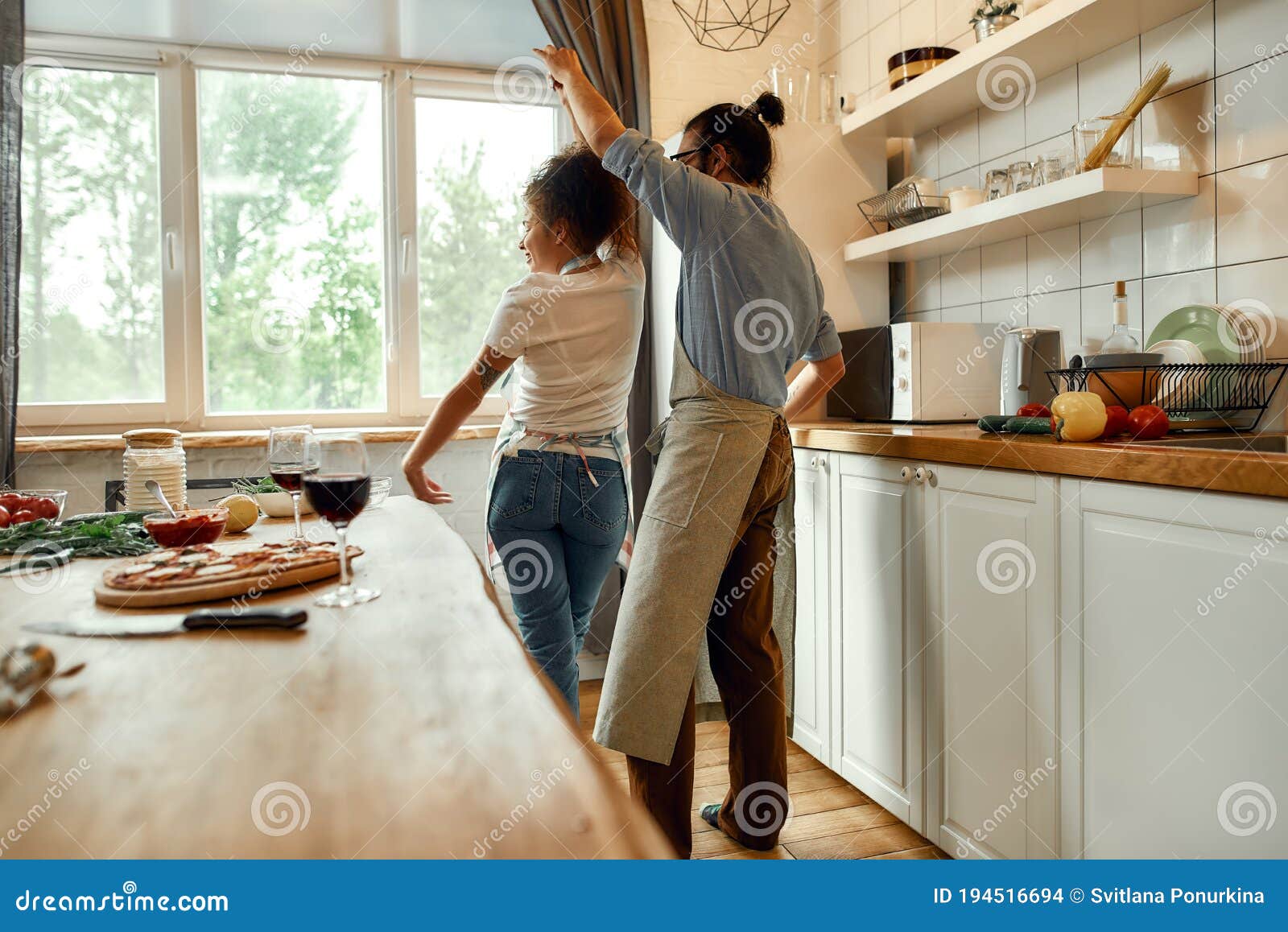Dance. Young Couple Having Fun, Dancing in the Kitchen while Preparing ...