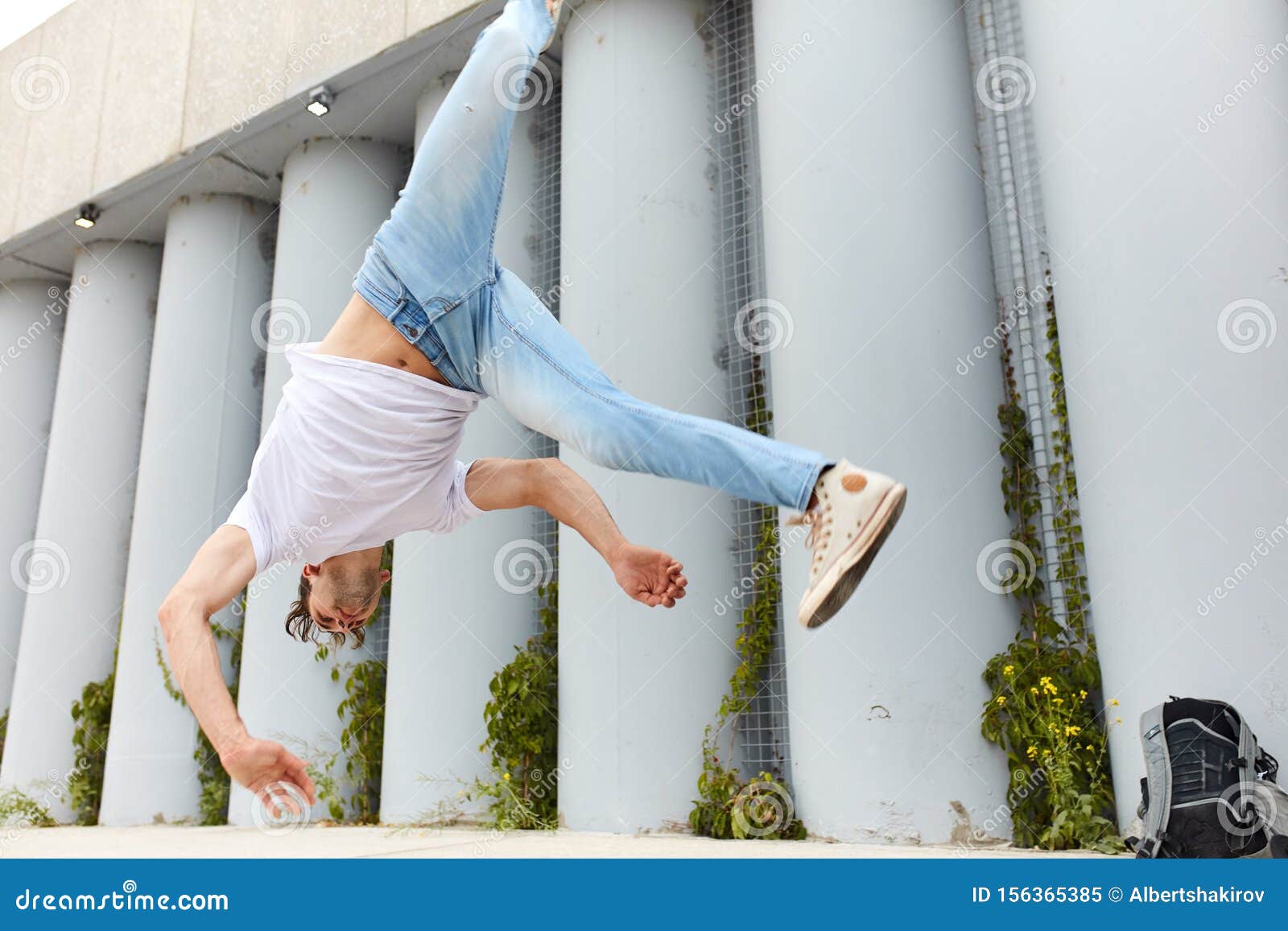Dancer Doing a Movement, Man Falling Down while Performing a Flip Stock ...