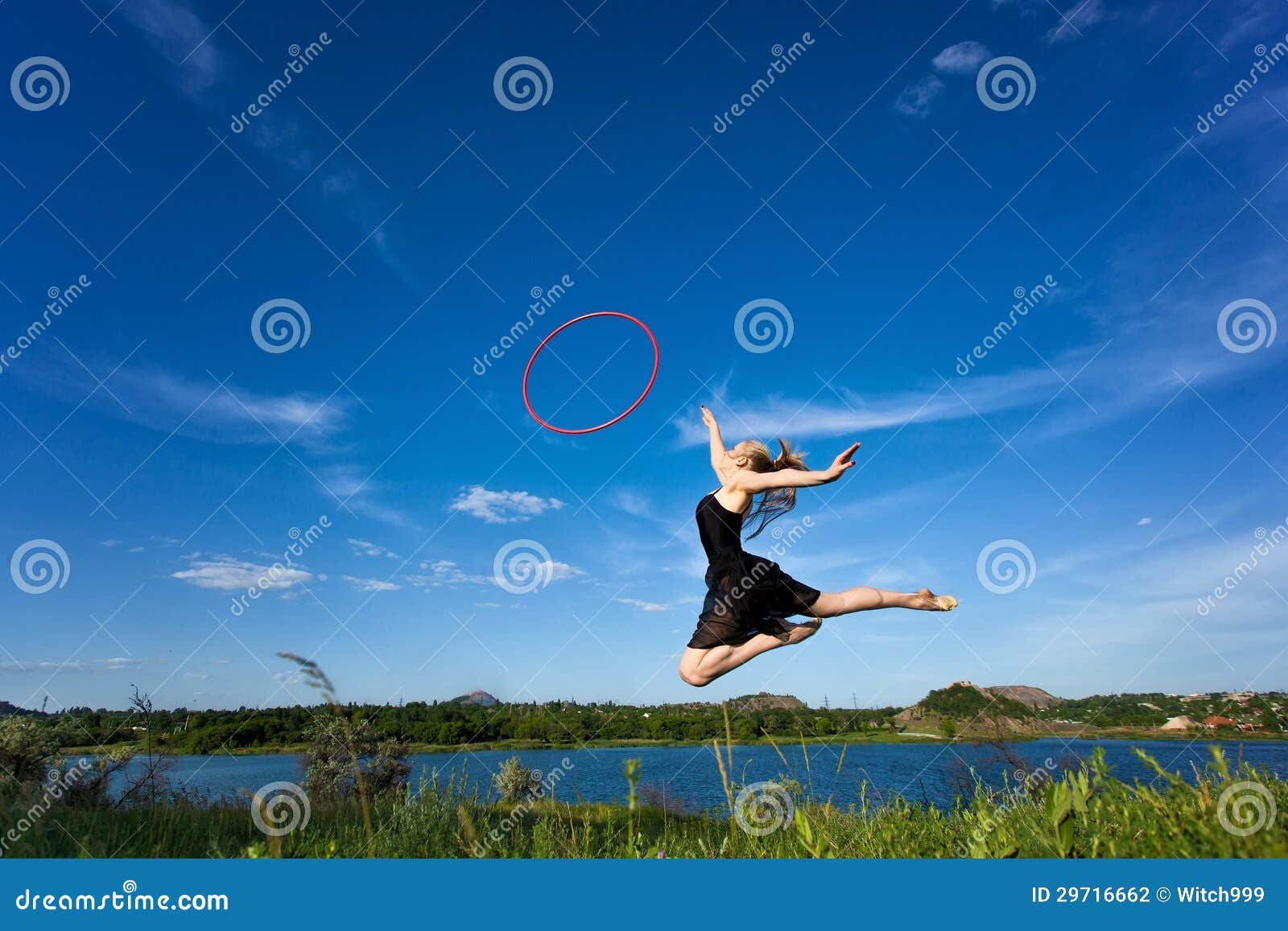 Jymnast with Hoop Jumping Against Blue Sky Stock Photo - Image of ...