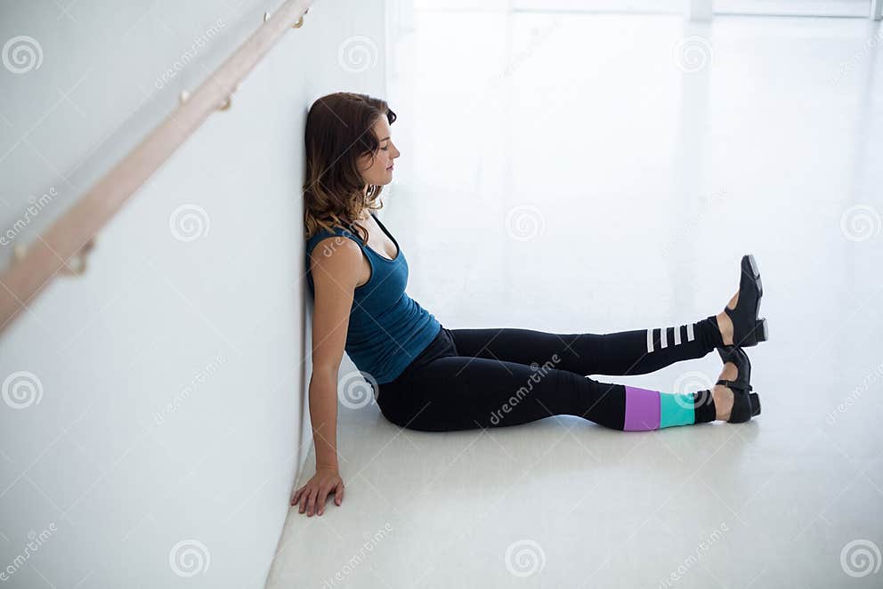 Dancer relaxing on floor stock image. Image of grace - 84095933