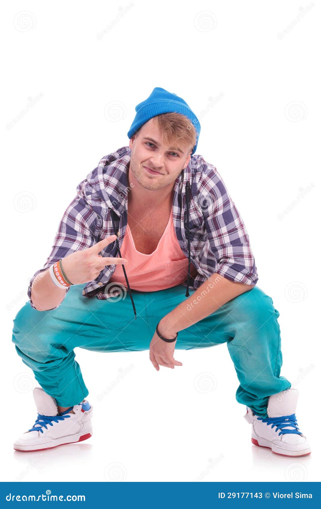 Dancer Squatting & Showing Peace Stock Image - Image of posing, sitting ...