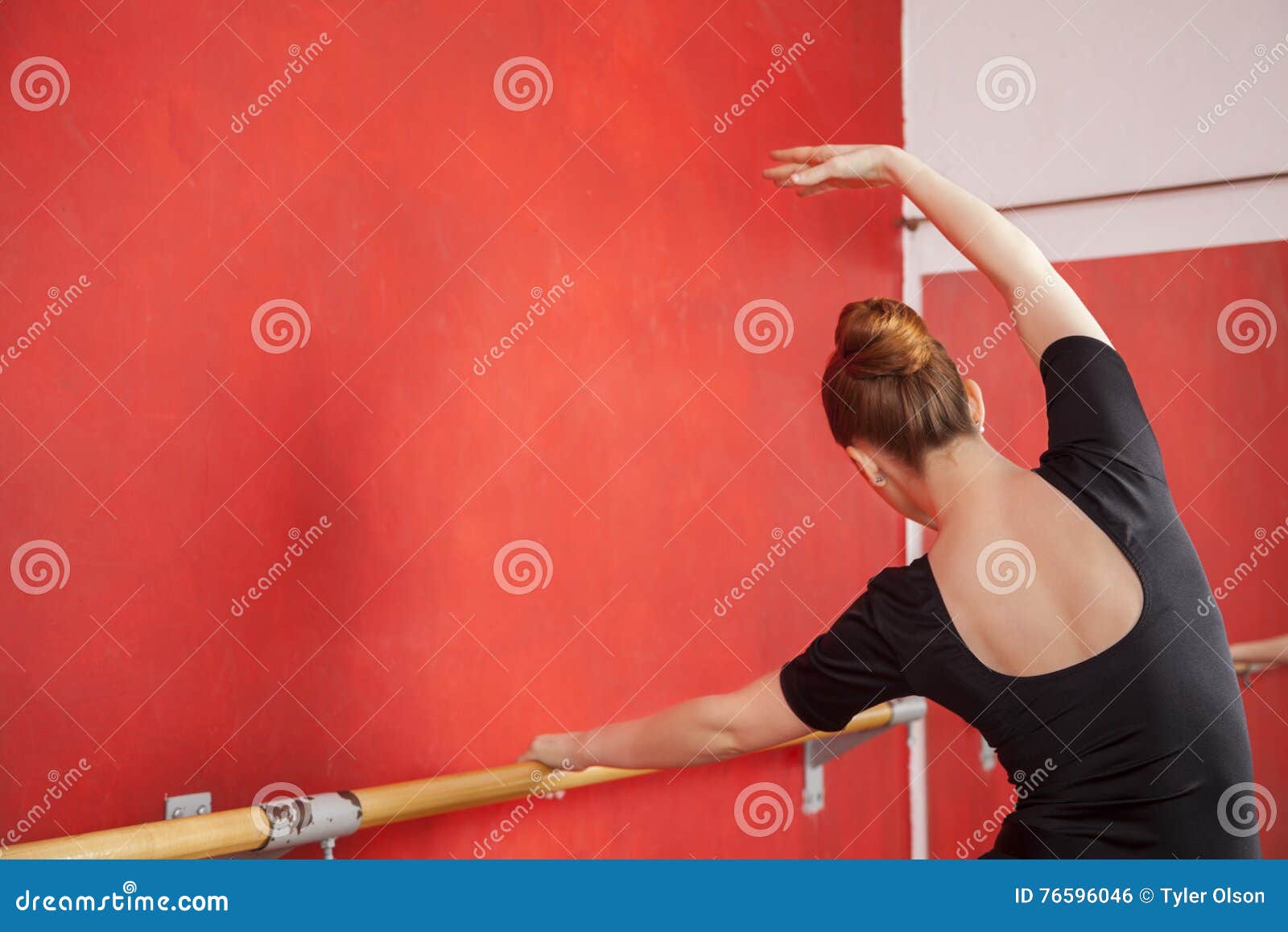 Dancer Stretching at Barre in Ballet Studio Stock Photo - Image of ...