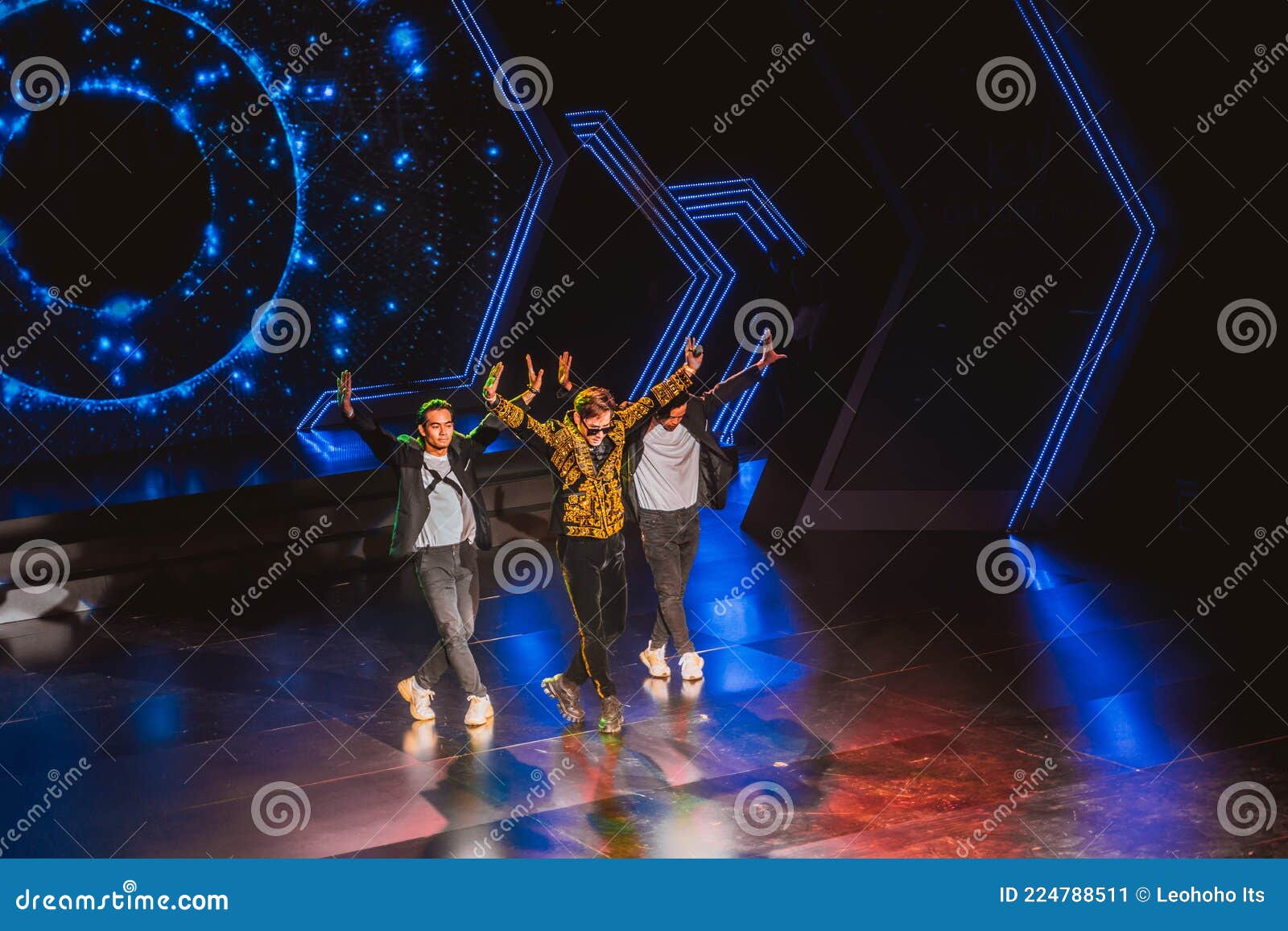 The Singer is Enthusiastically Performing on Stage. Singer Dancing in ...