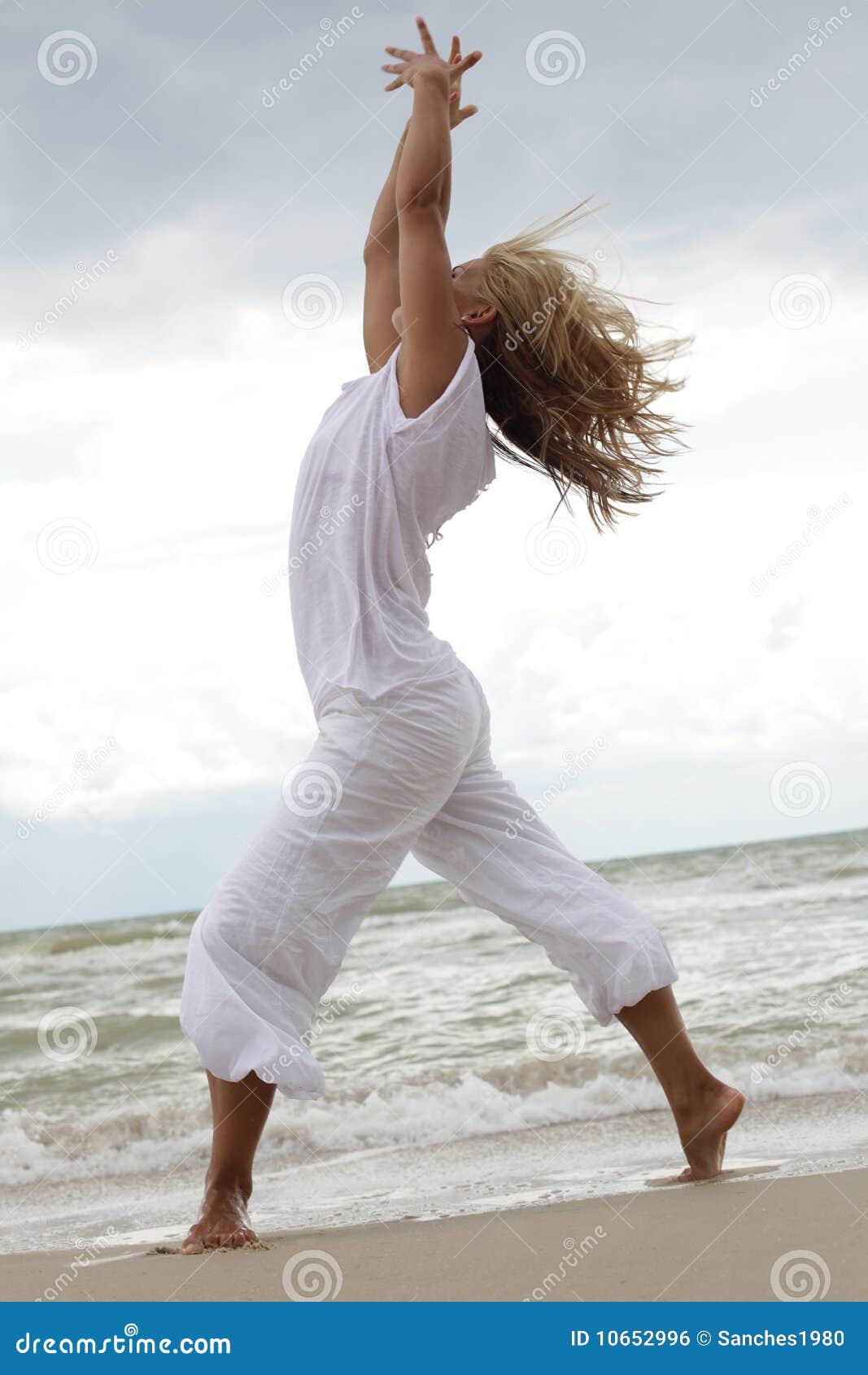 Dancing on the beach stock photo. Image of exercise, adult - 10652996