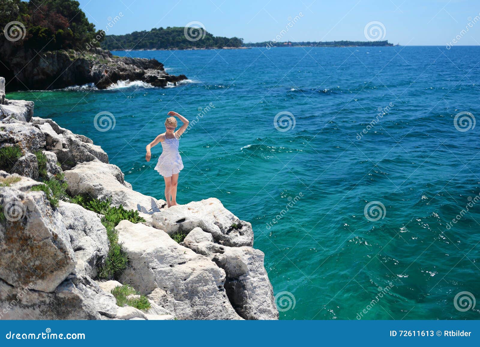 Dancing on a cliff stock image. Image of people, female - 72611613