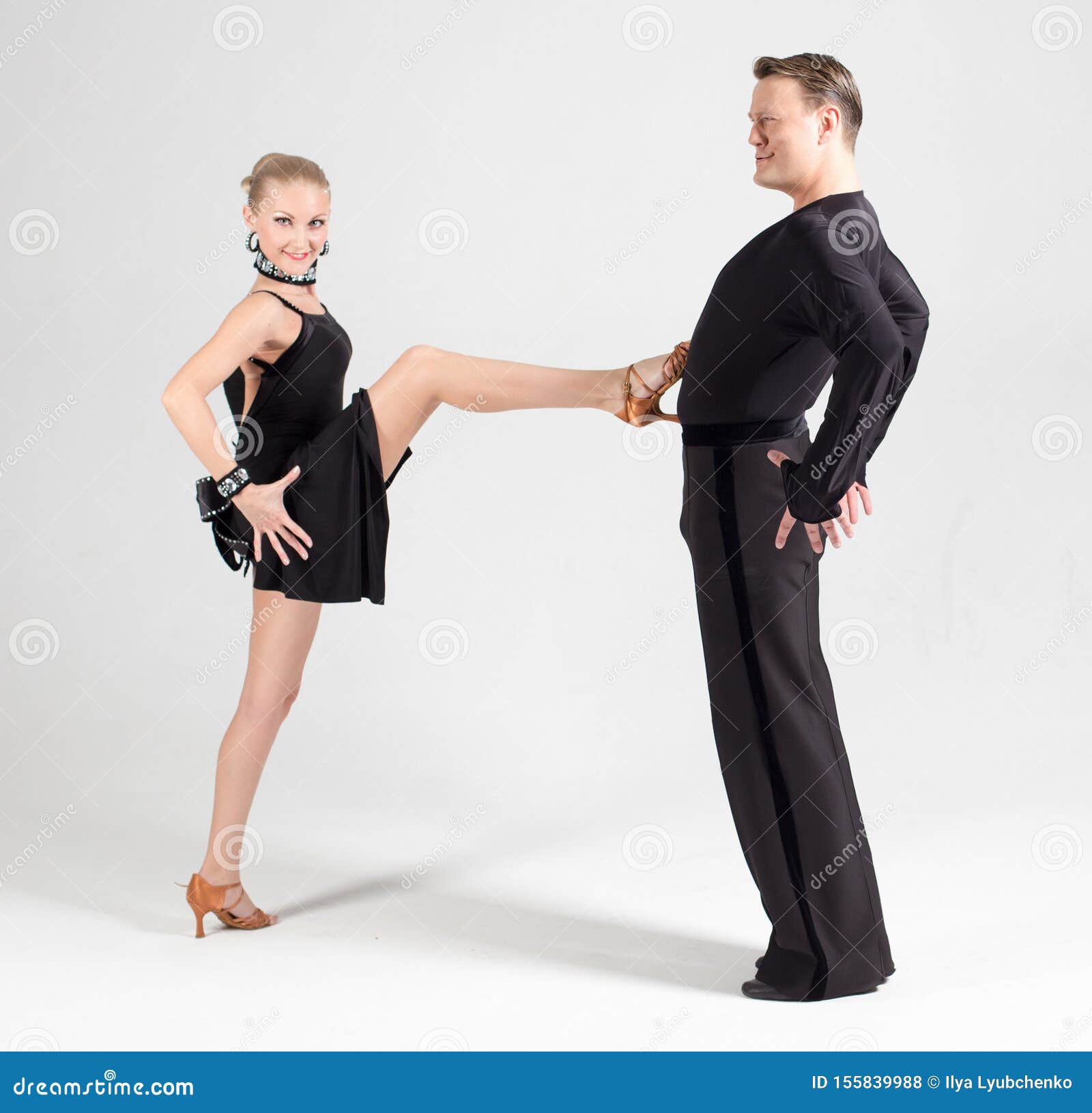 Dancing Couple Her Foot in His Chest, Super Stock Photo - Image of ...