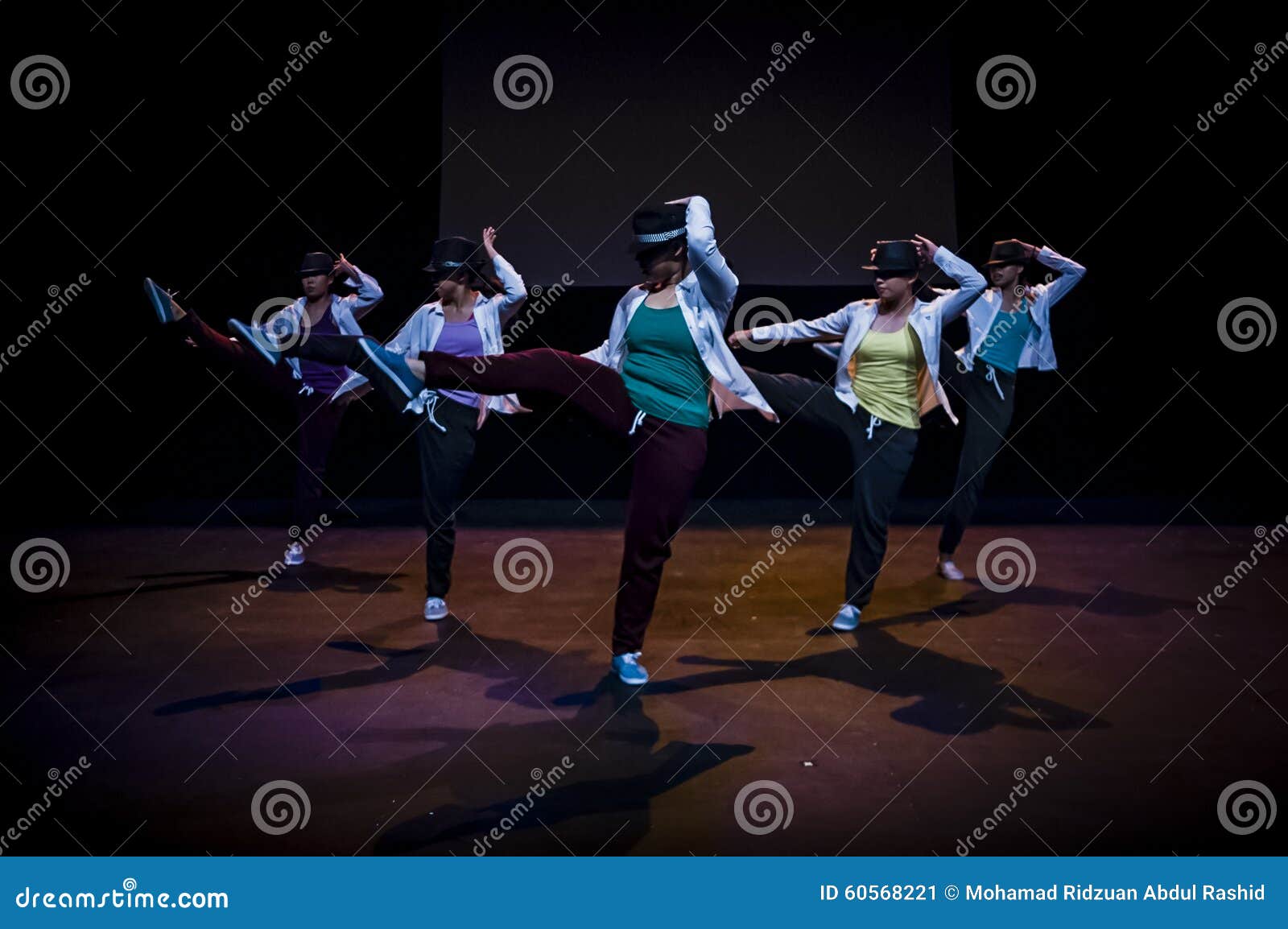 Dancing in dark studio editorial photo. Image of action - 60568221