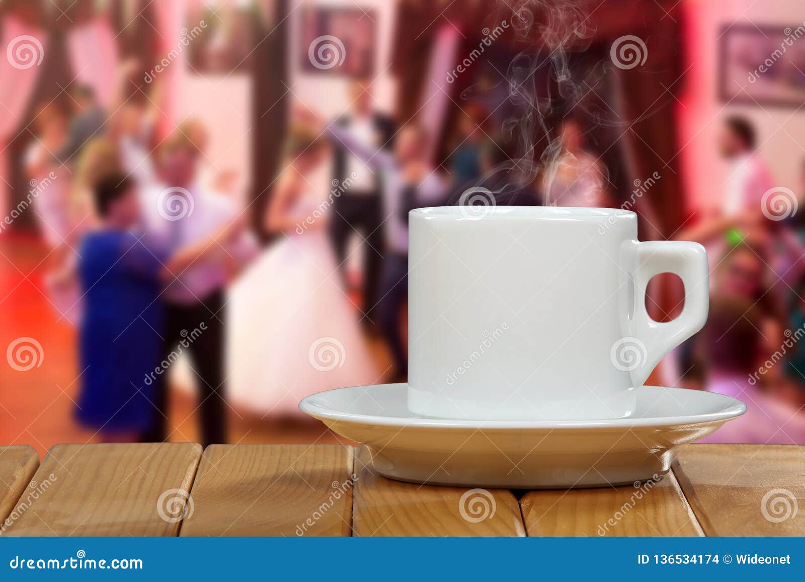 Dancing People at a Party Against a Cup of Coffee or Tea Stock Photo ...