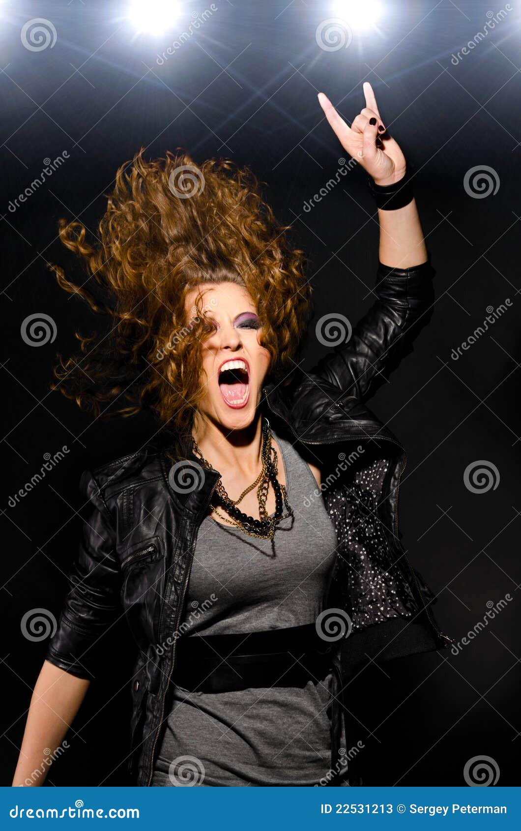 Dancing to the rock music stock image. Image of horns - 22531213