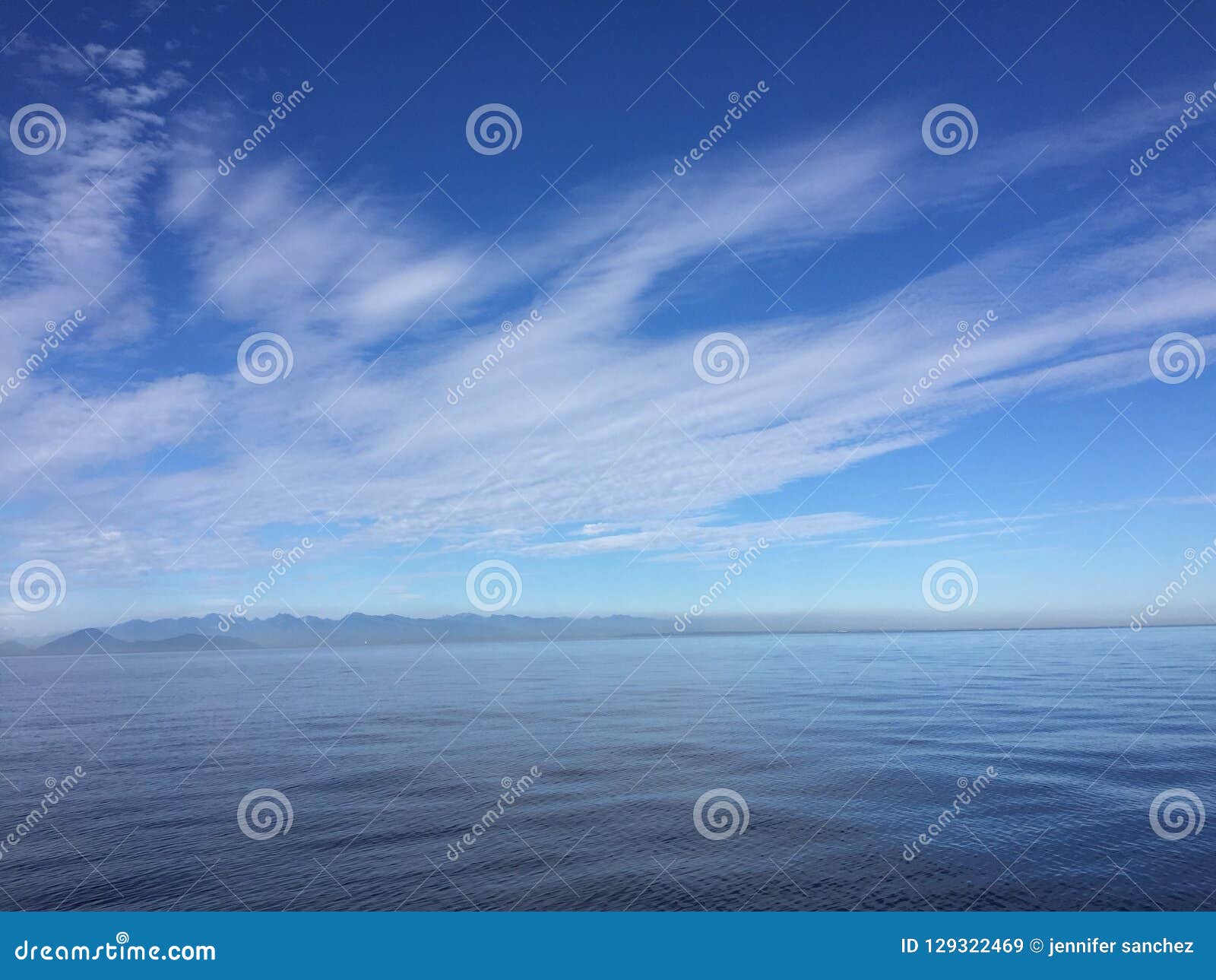 Nothing but ocean and sky stock image. Image of clouds - 129322469