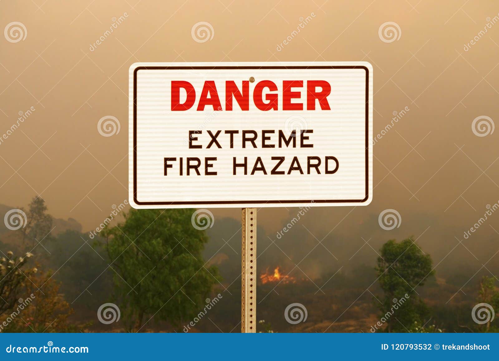 Danger Extreme Fire HazardSign with Wildfire Background Stock Photo ...