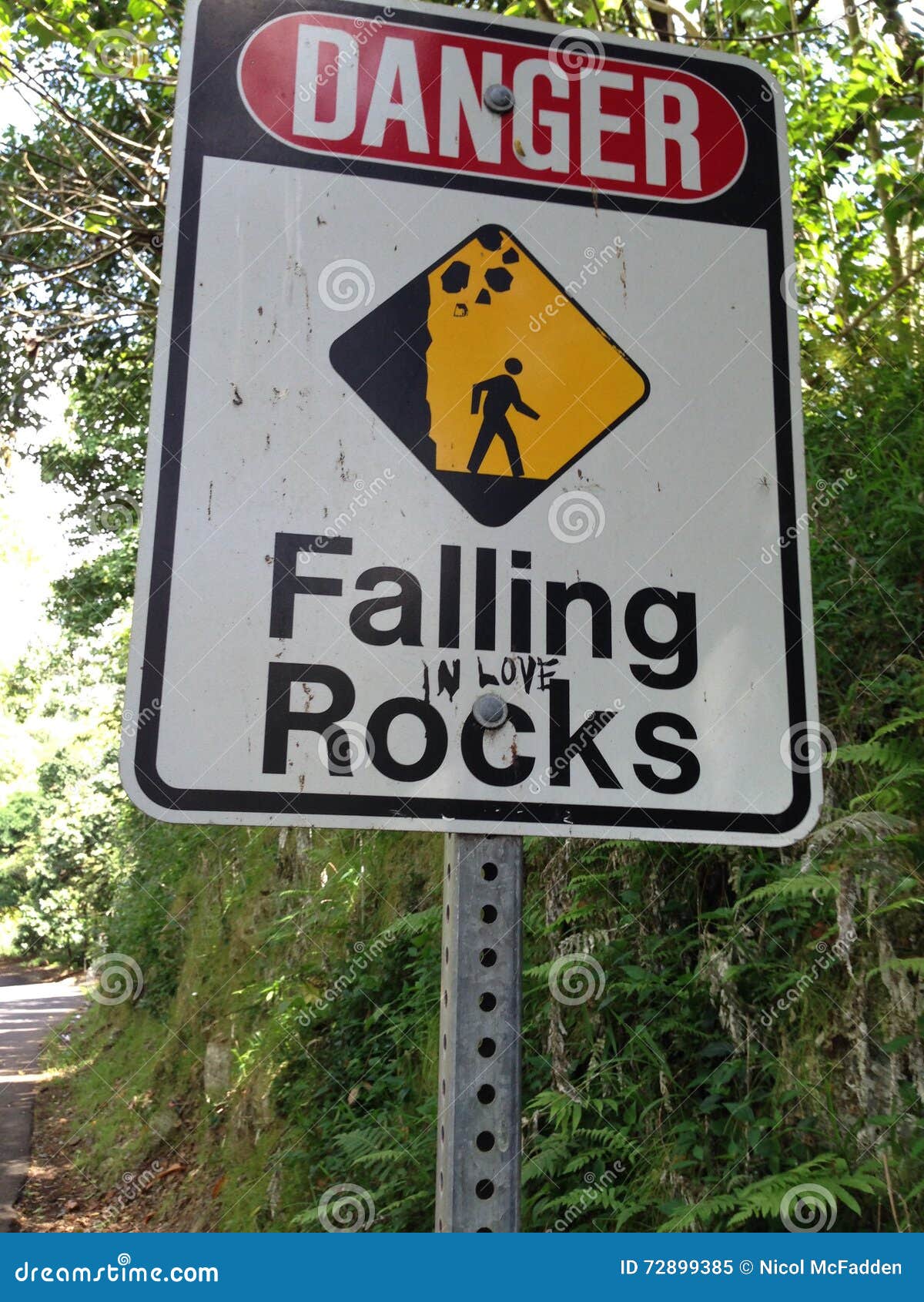 Danger Falling Rocks Graffiti Stock Image - Image of rocks, sign: 72899385