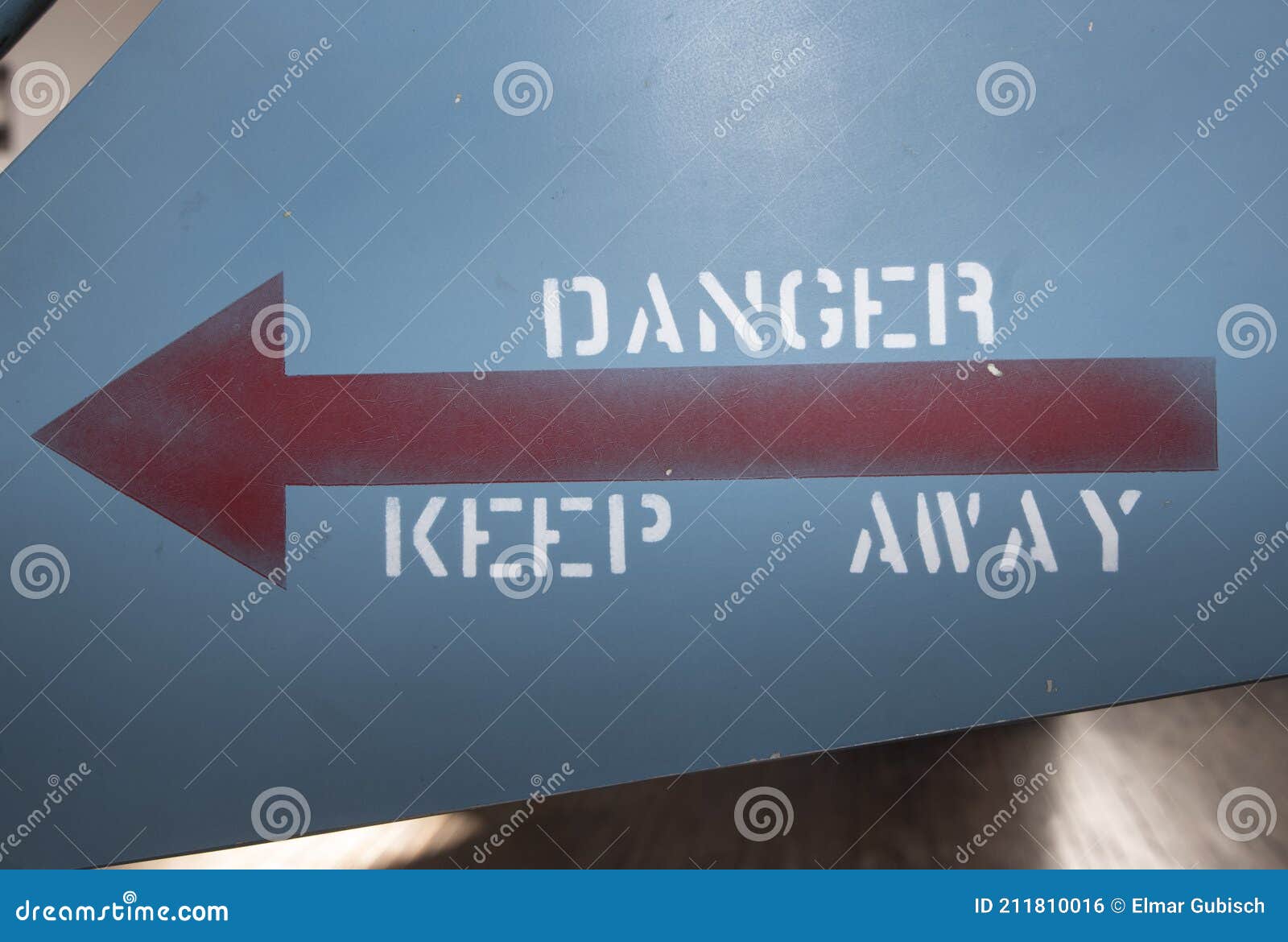Danger Keep Away Sign with Direction Arrow Stock Photo - Image of ...