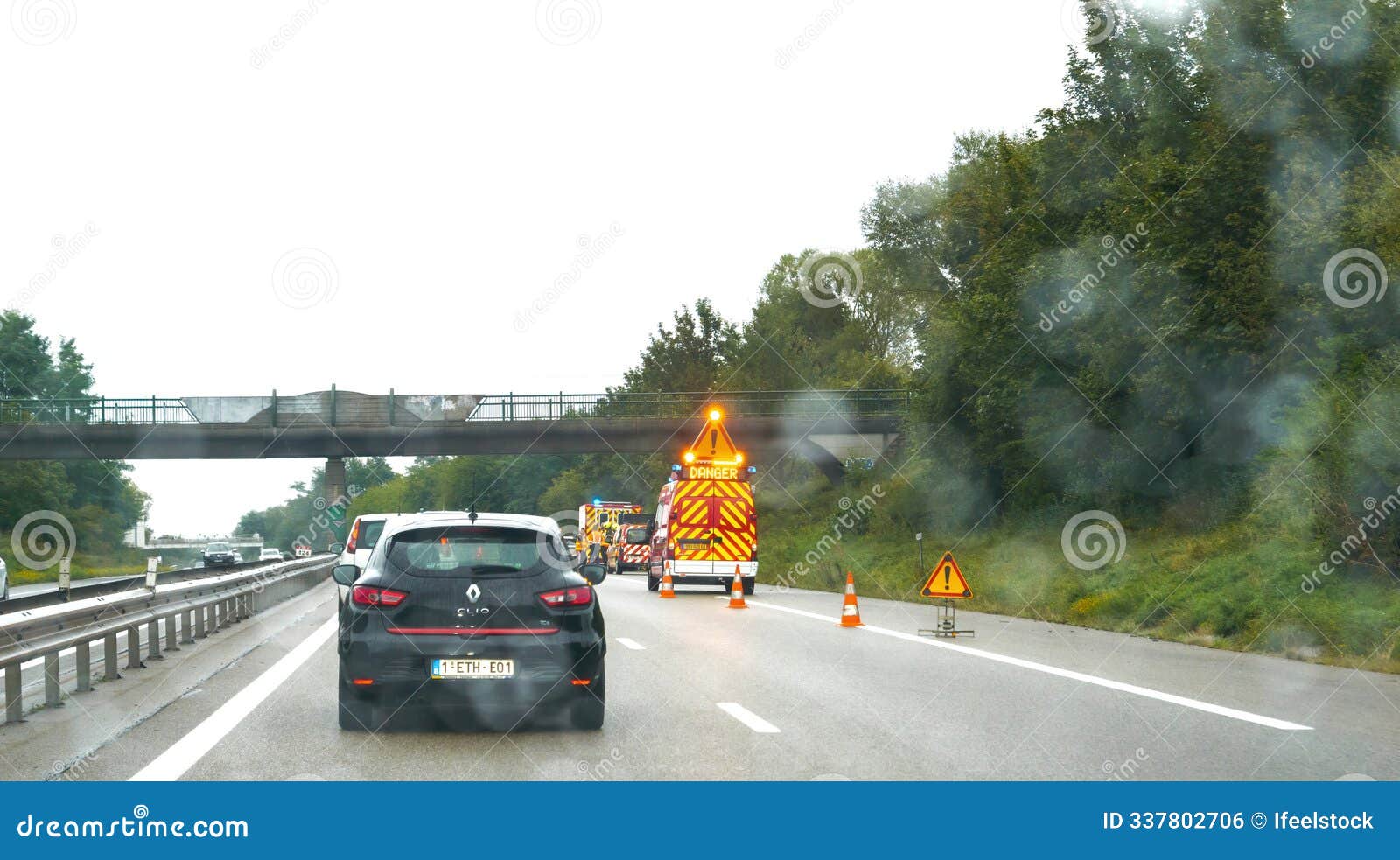 Danger Sign and Emergency Vehicles on Highway Editorial Photo - Image ...