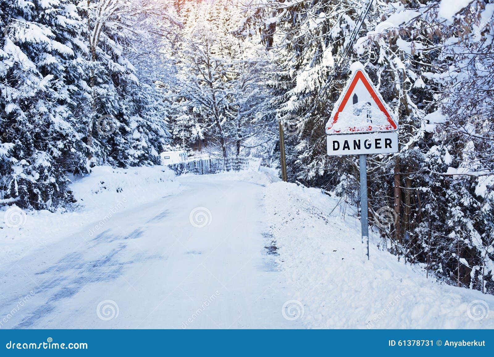 Danger sign on icy road stock image. Image of travel - 61378731
