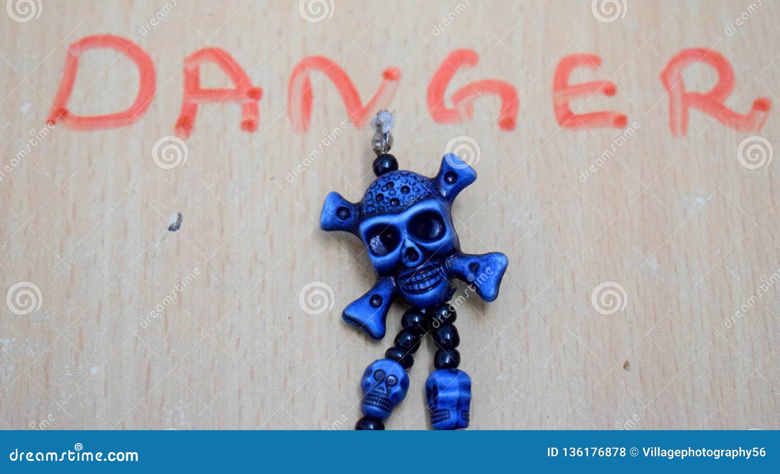 Danger skeleton with skull stock photo. Image of caution - 136176878