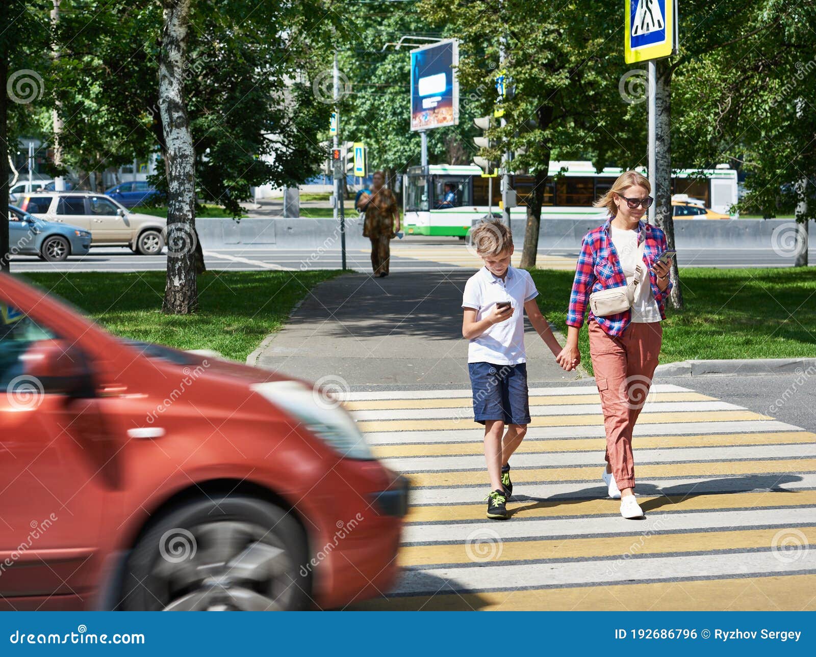 Danger of Using Smartphone by Pedestrians on Road Stock Photo - Image ...