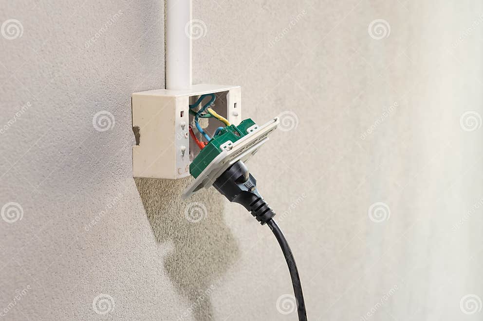 Dangerous Broken Electrical Socket Falling Out of Wall Stock Photo ...