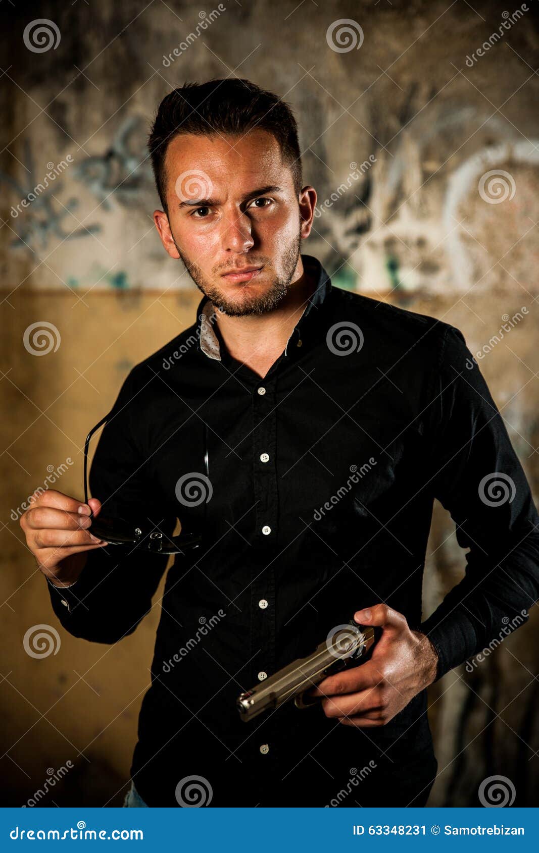 Dangerous man with a gun stock image. Image of dark, confident - 63348231