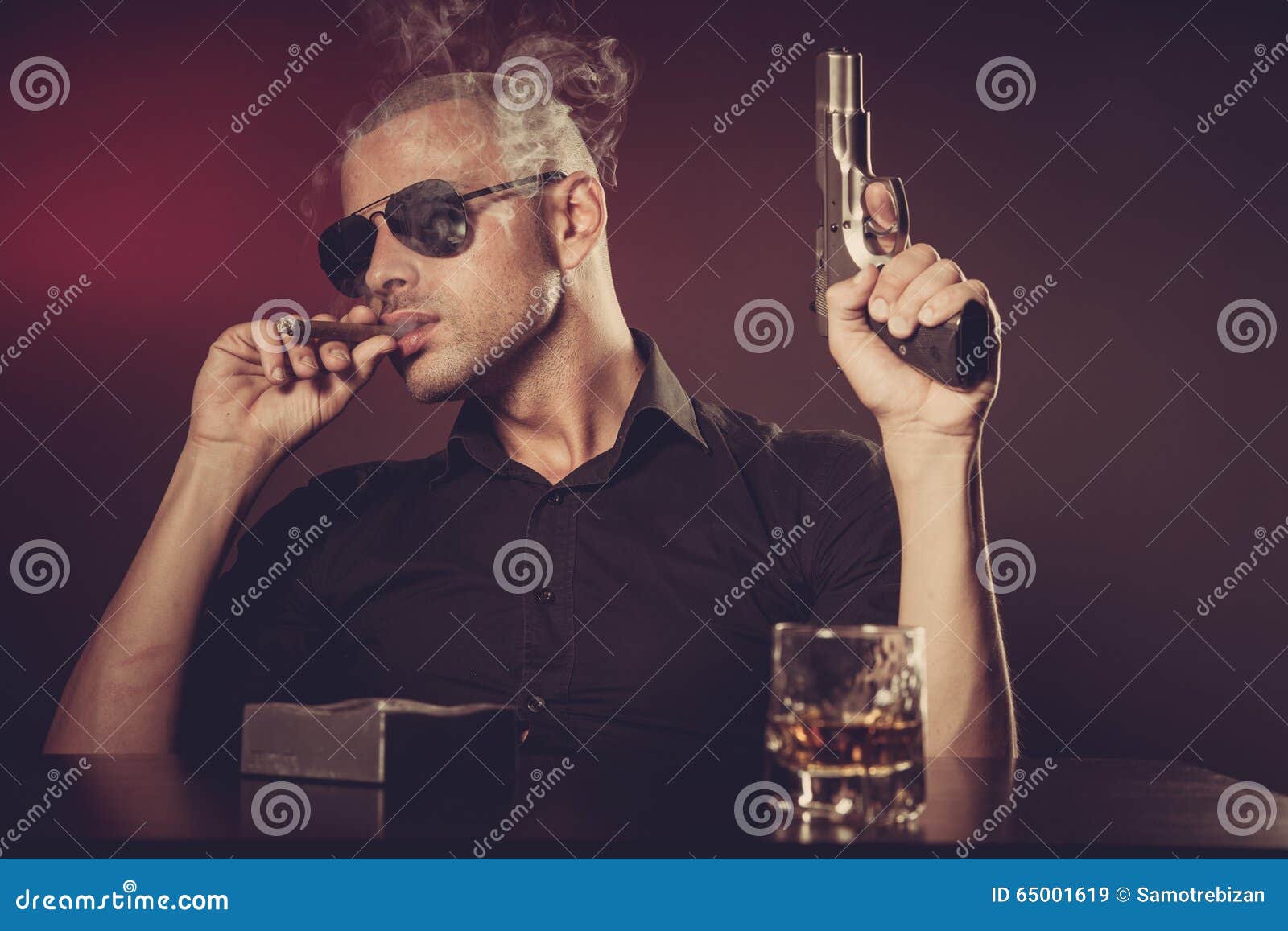 Dangerous man with a gun stock image. Image of person - 65001619