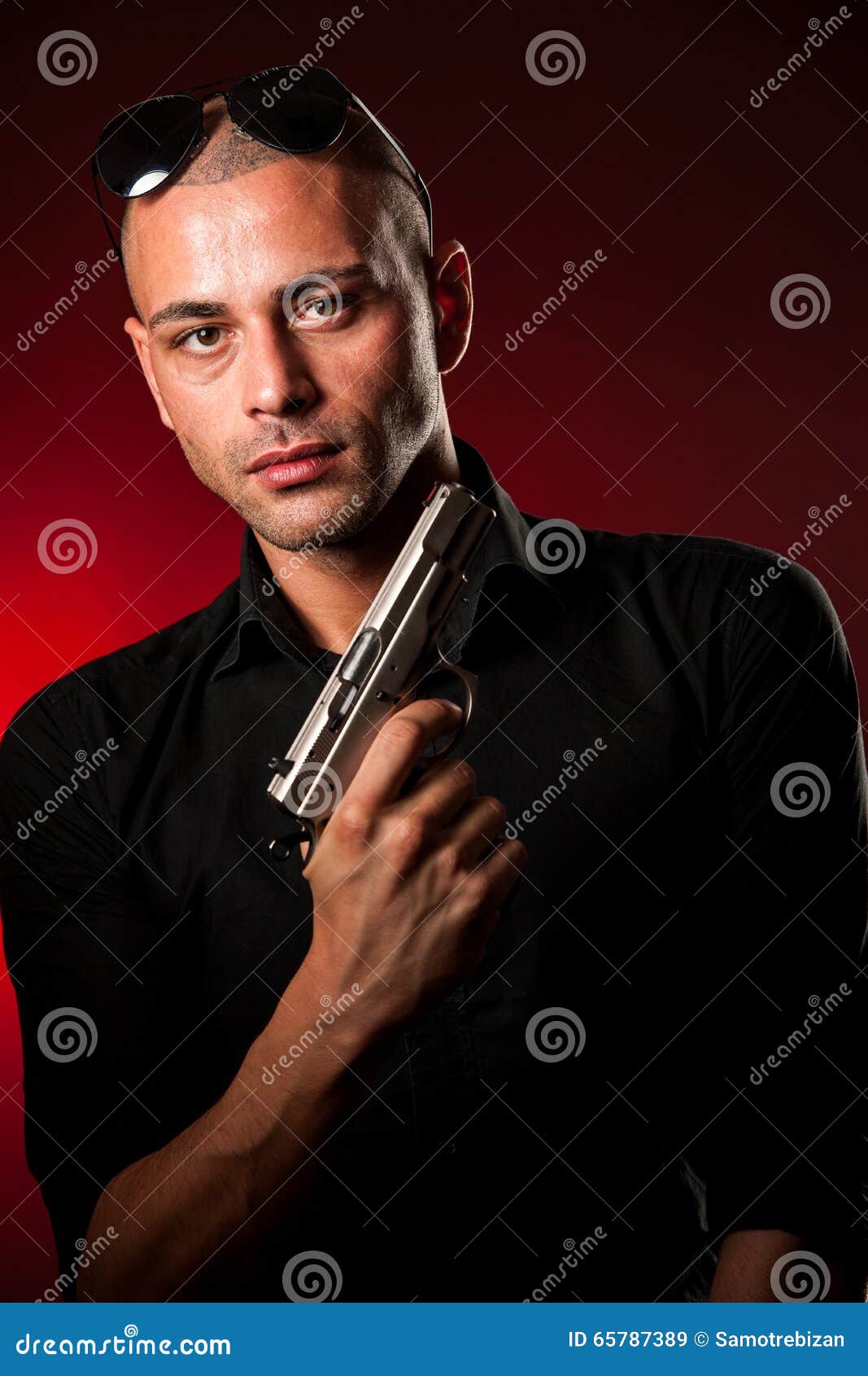 Dangerous man with a gun stock image. Image of handgun - 65787389
