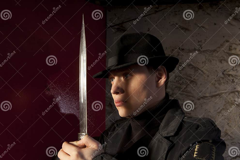 A Dangerous Man Holding Dagger Stock Photo - Image of bandit, attack ...