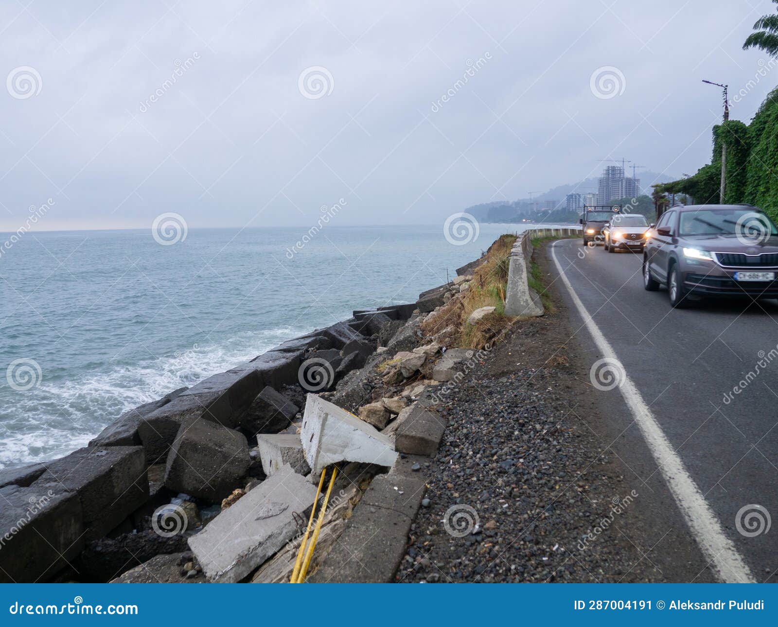 Dangerous Place. Collapsed Road Barrier On A Mountainside. Old Blocks ...