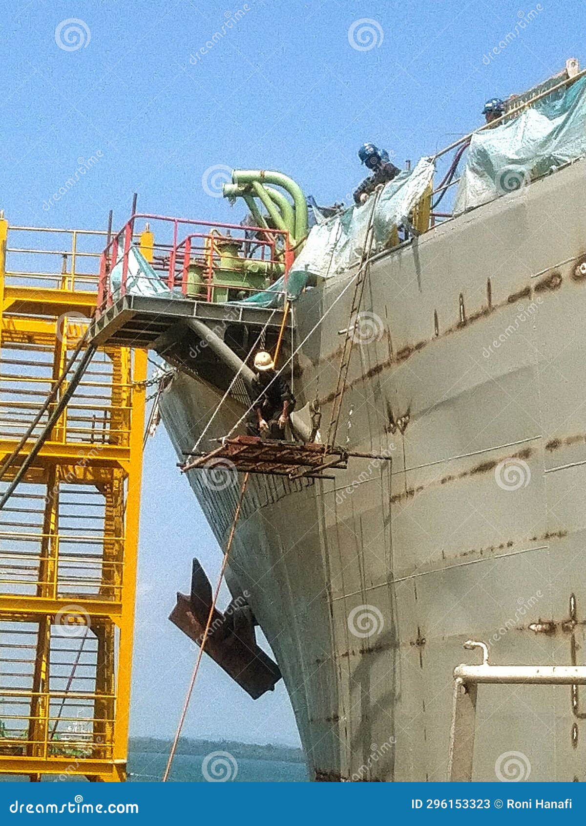 Dangerous ship repairs stock image. Image of personnel - 296153323