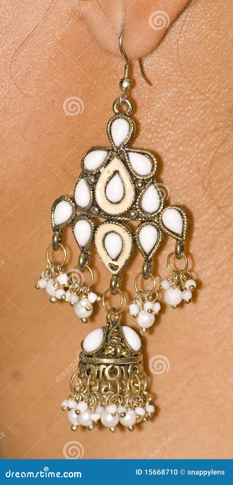 Dangling ear ornament stock photo. Image of beads, white - 15668710